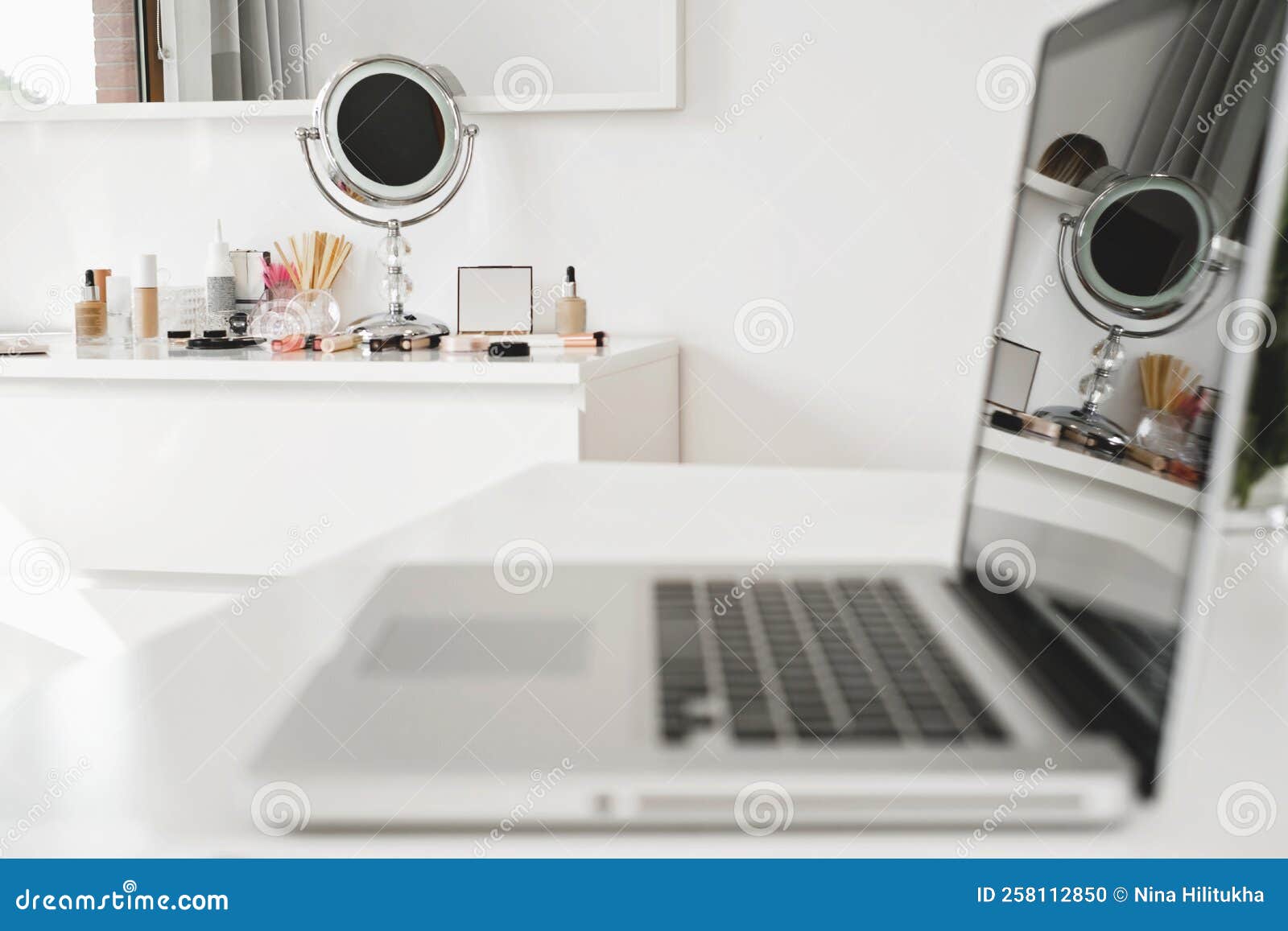 Set of Decorative Cosmetics and Mirror on Dressing Table with Laptop ...