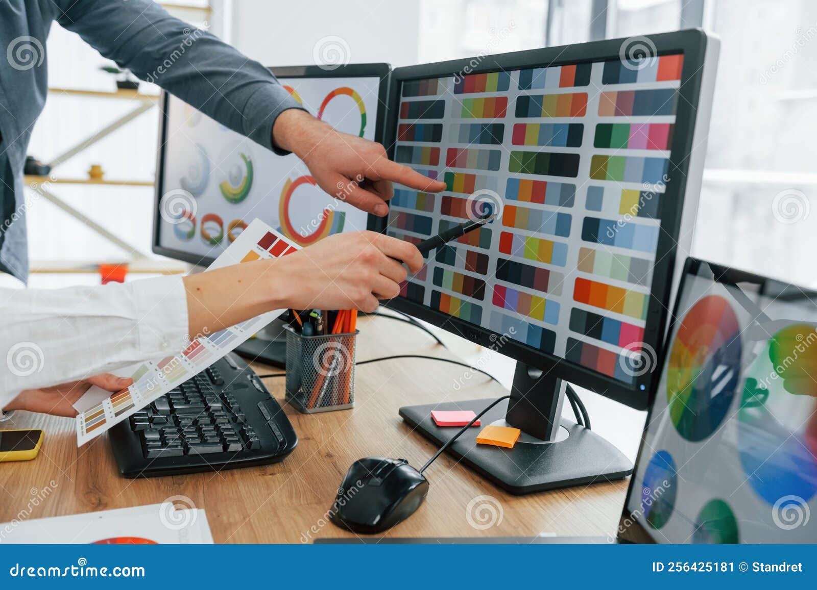 Set of Different Colors. Two Designers Working Together in the Office ...