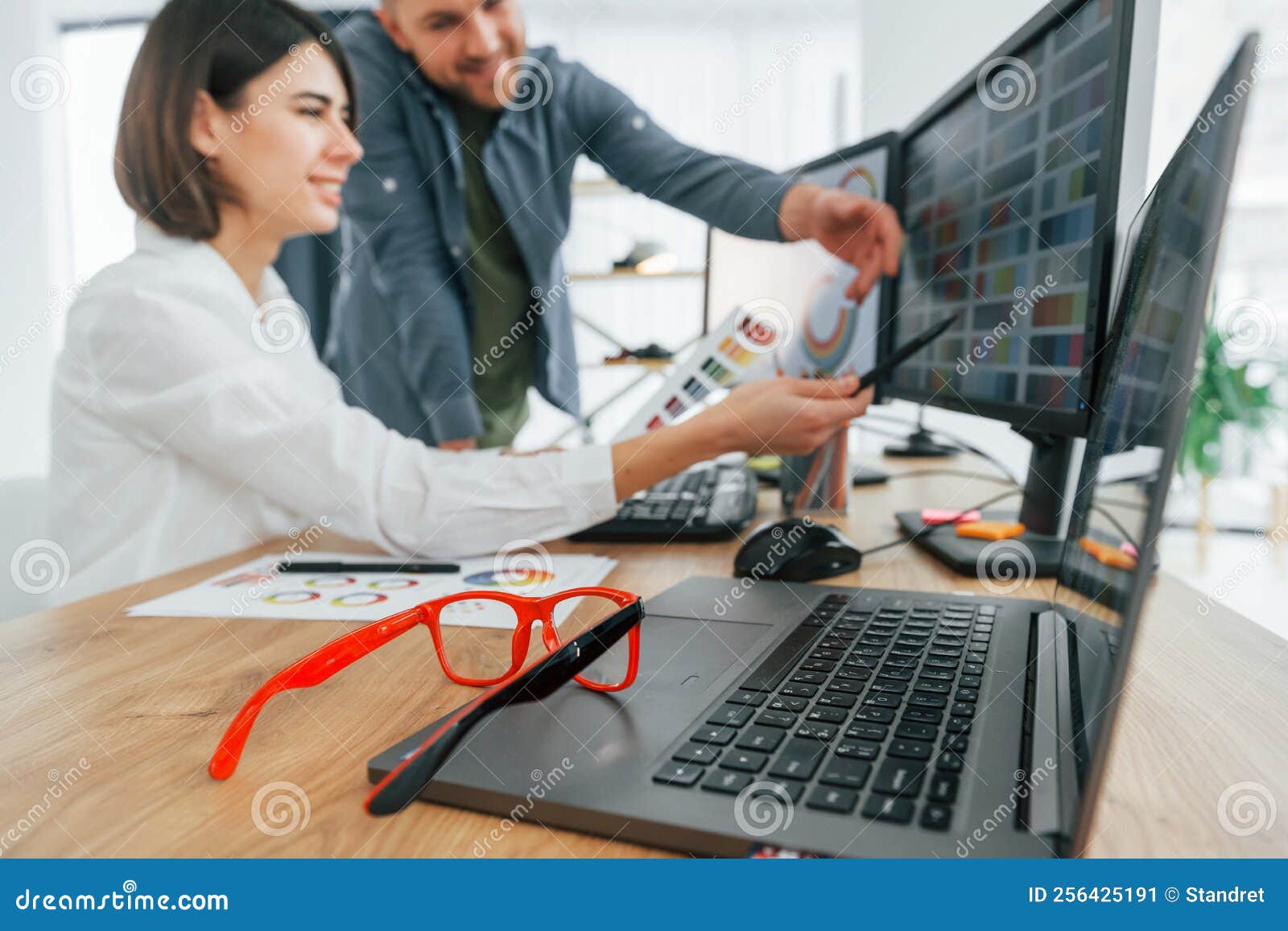 Set of Different Colors. Two Designers Working Together in the Office ...