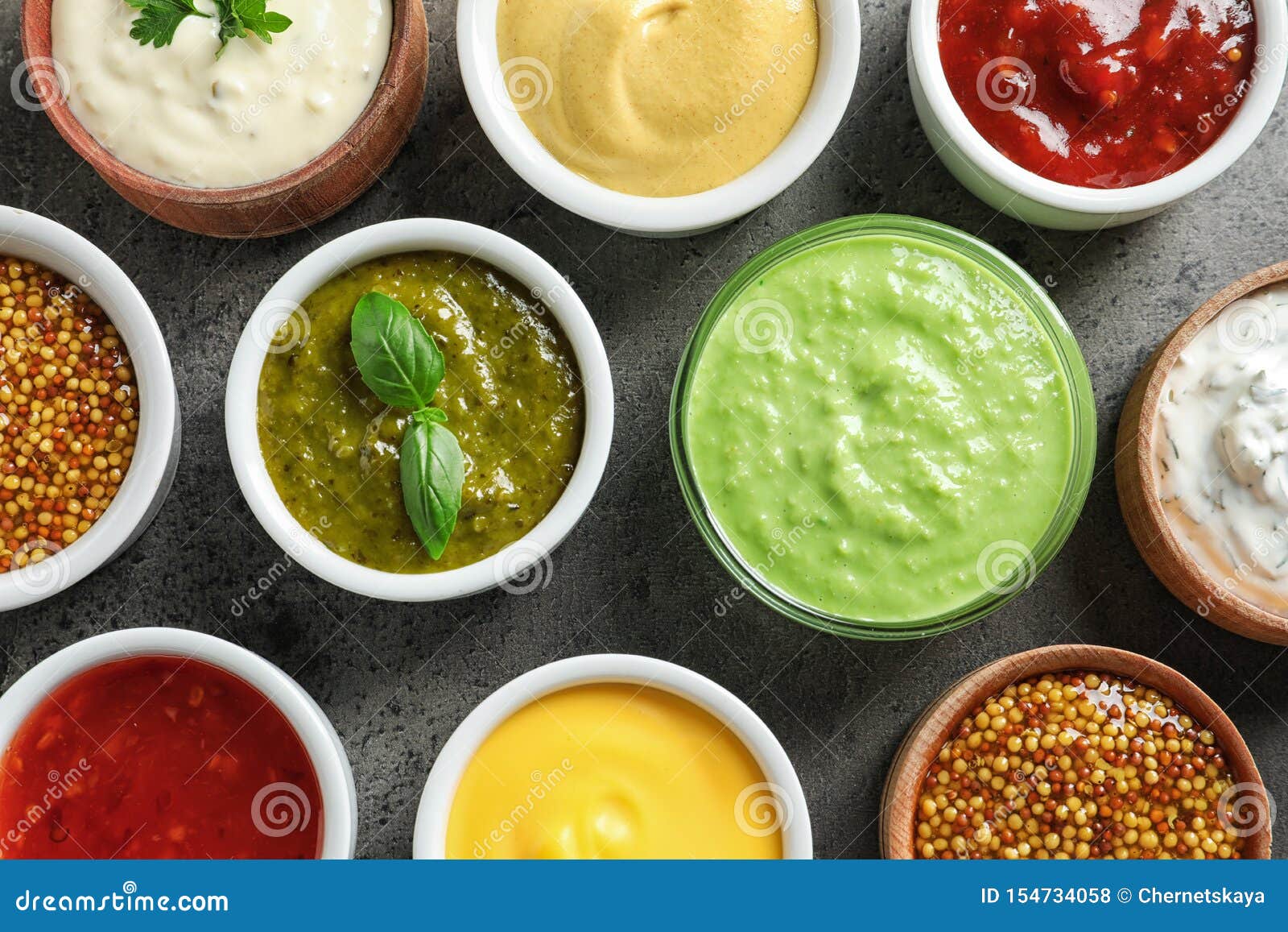 Set of Different Delicious Sauces on Grey Table, Top Stock Photo ...