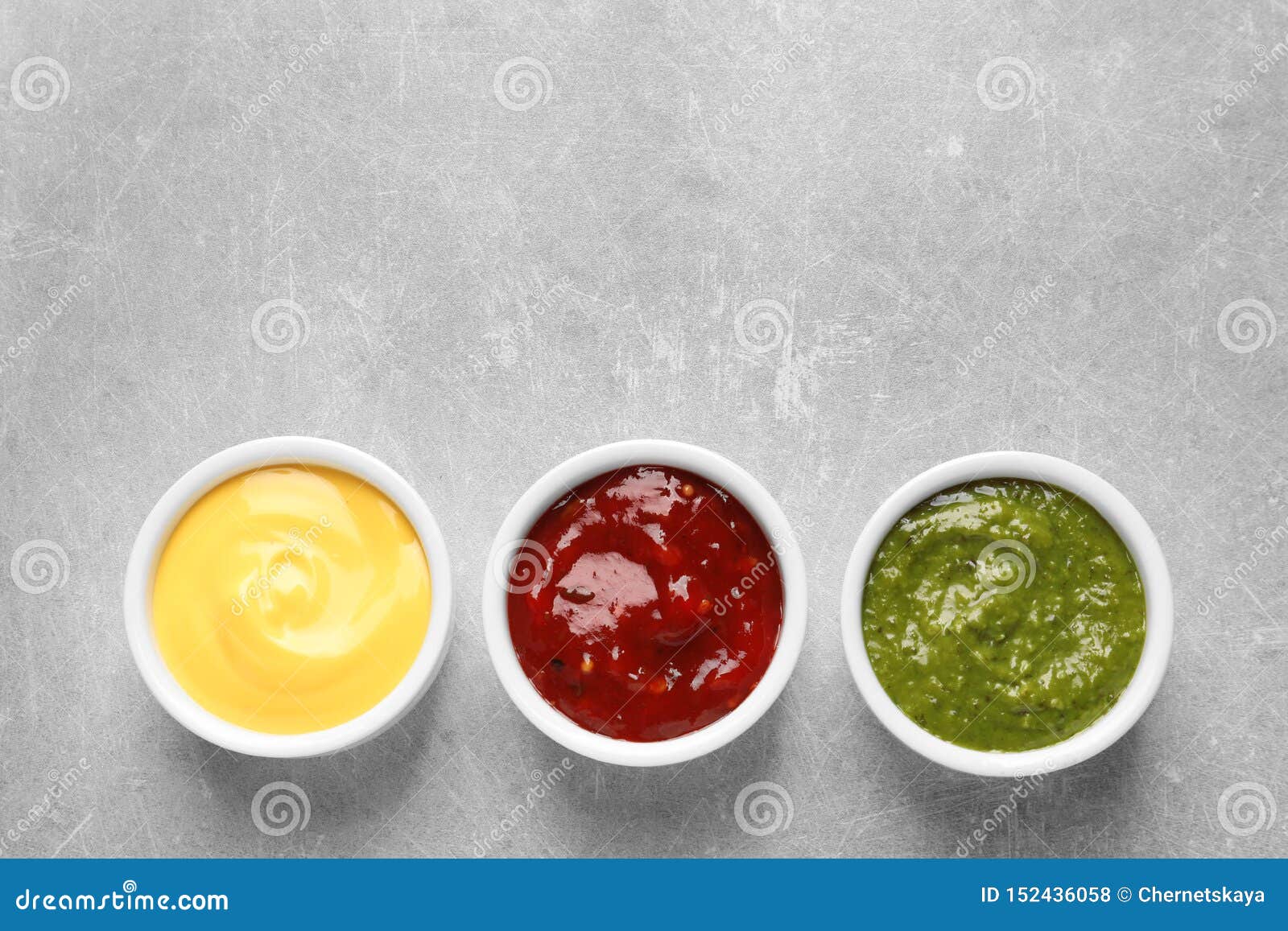 Set of Different Delicious Sauces on Grey Table. Space for Text Stock ...