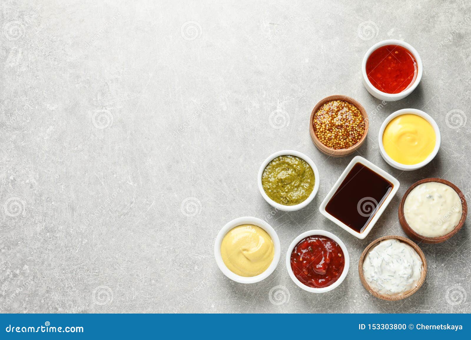 Set of Different Delicious Sauces on Grey Table, Top View Stock Photo ...