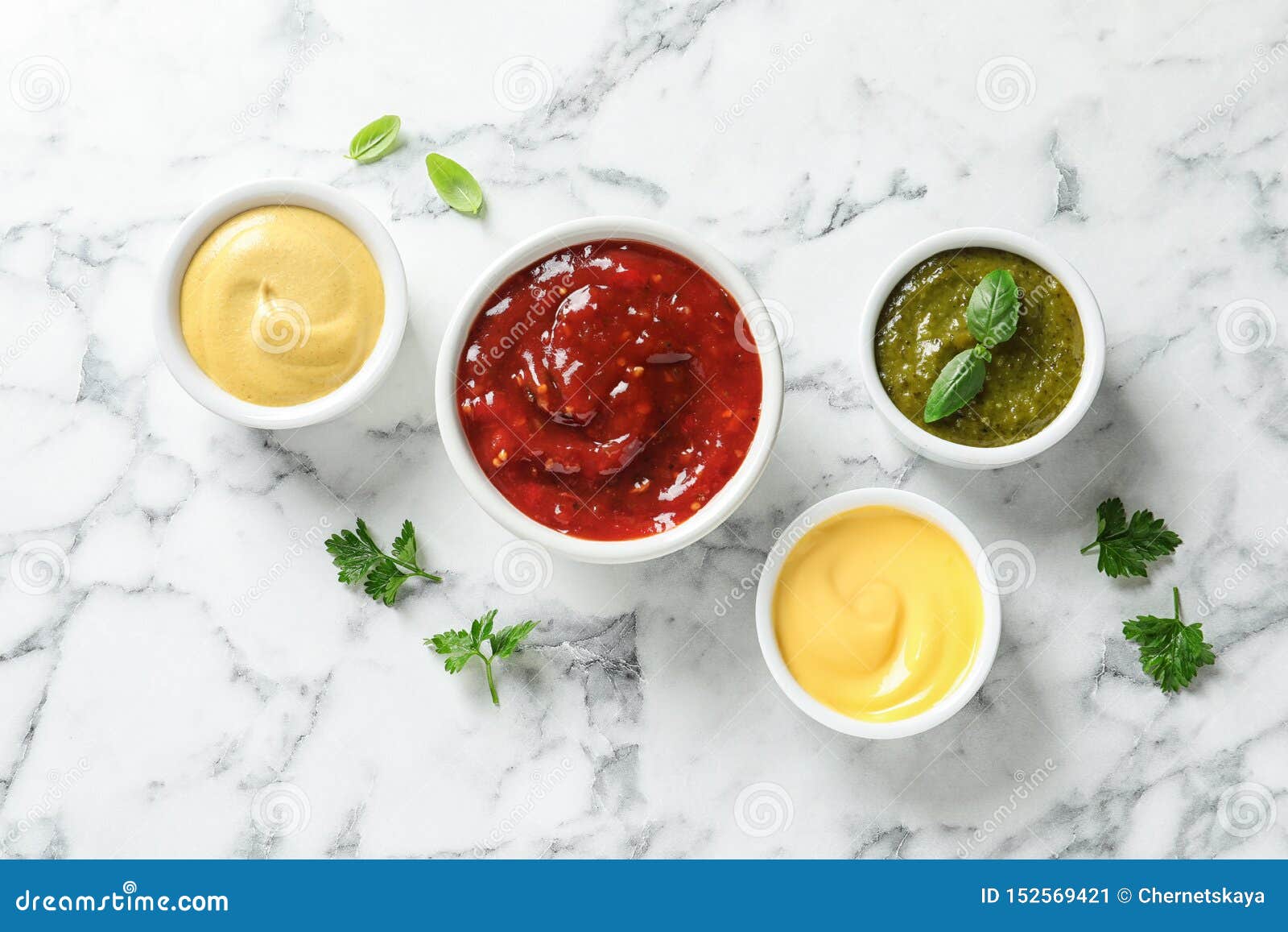Set of Different Delicious Sauces on White Marble Table Stock Image ...