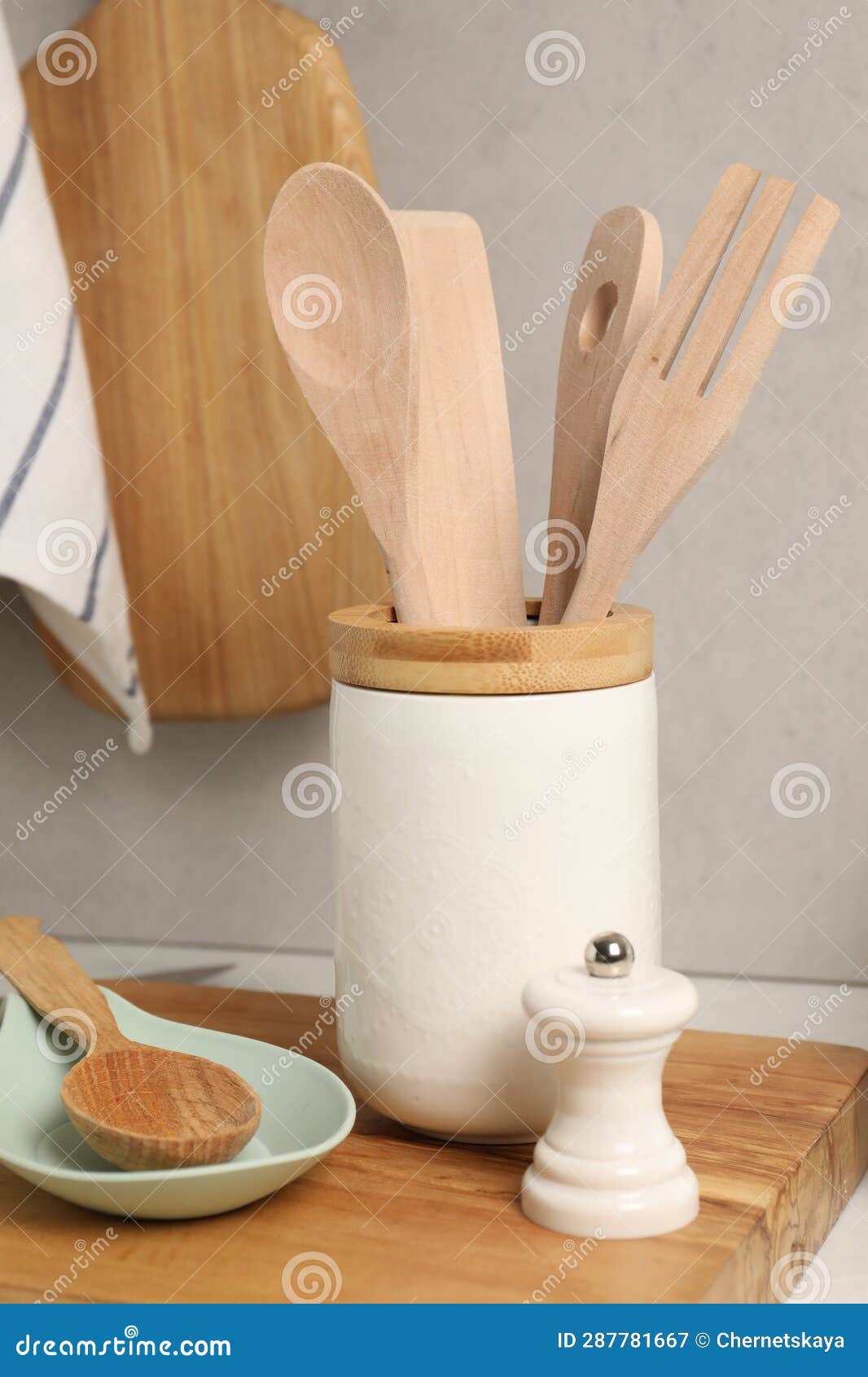 Set of Different Kitchen Utensils on Table Near Gray Wall Stock Image ...