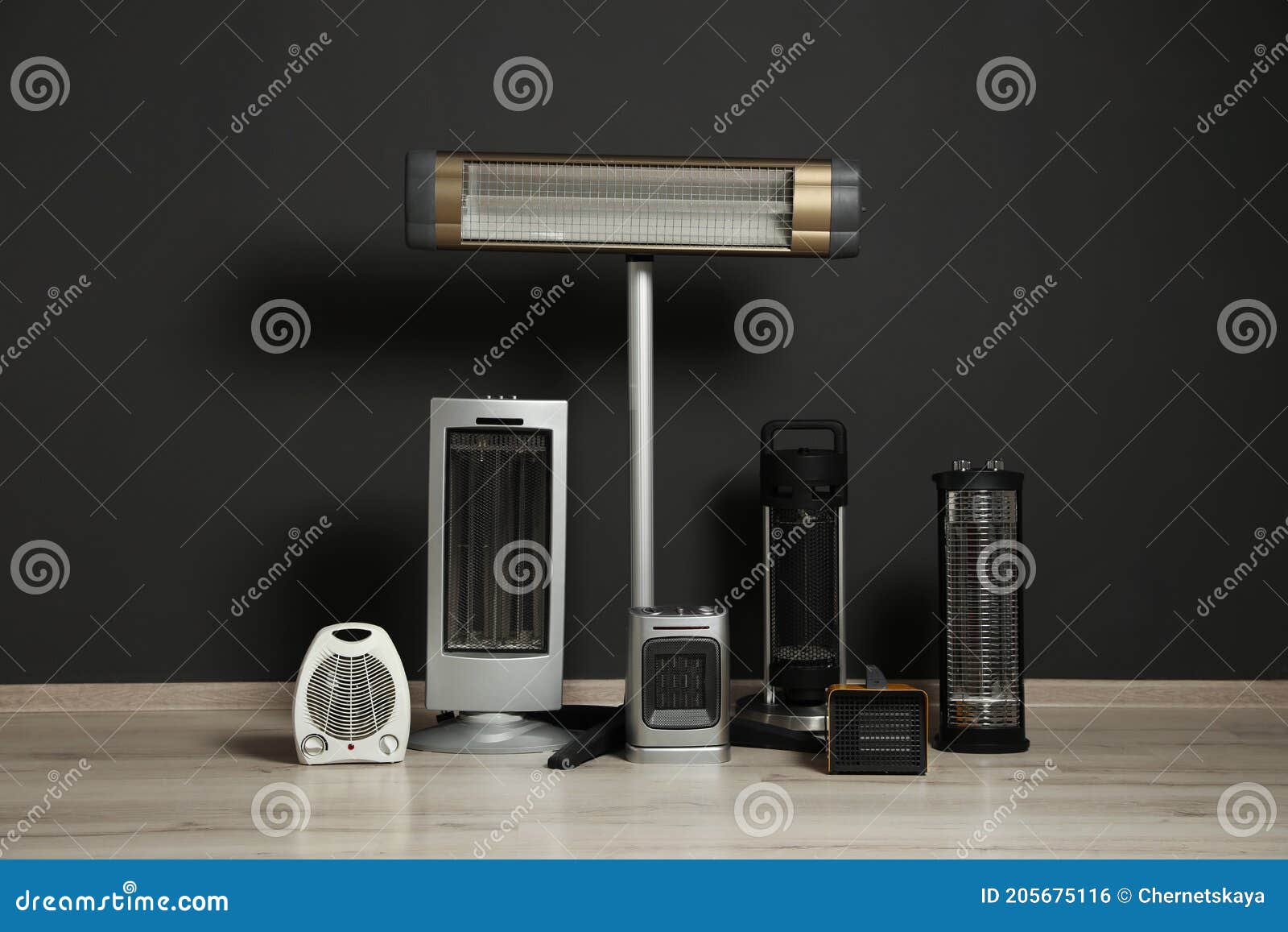 Set of Different Modern Electric Heaters Near Black Wall Stock Photo ...