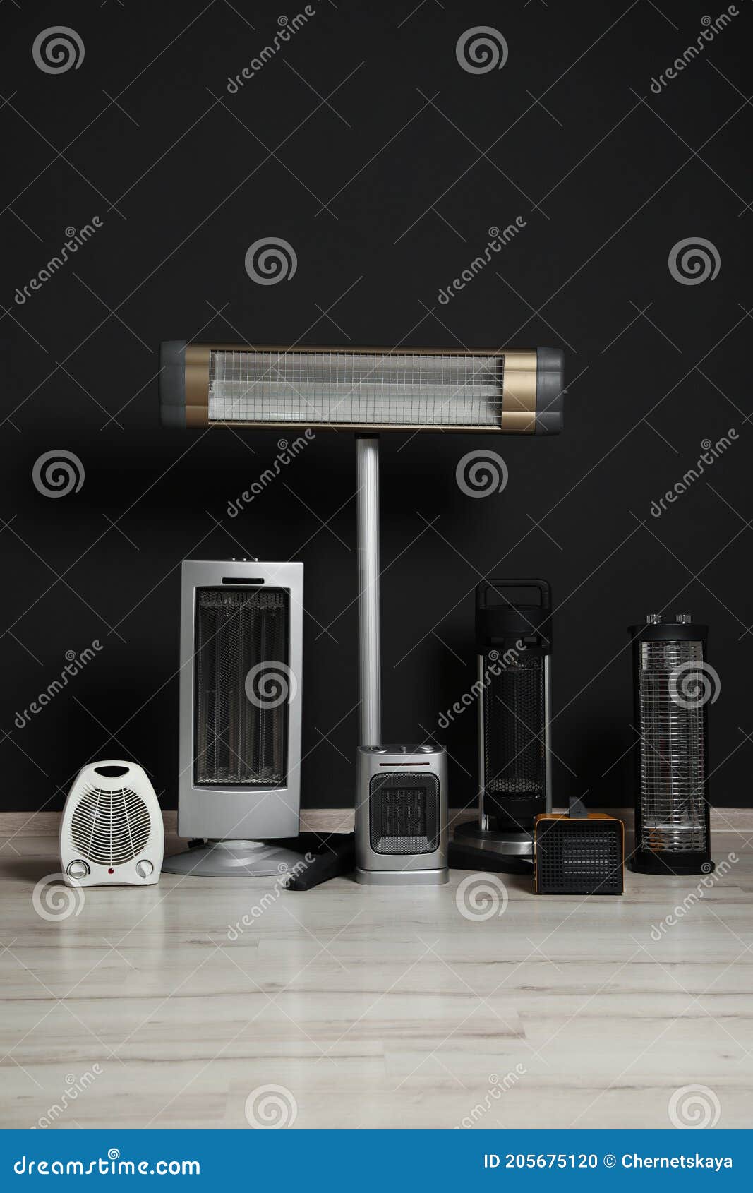 Set of Different Modern Electric Heaters Near Black Wall Stock Photo ...