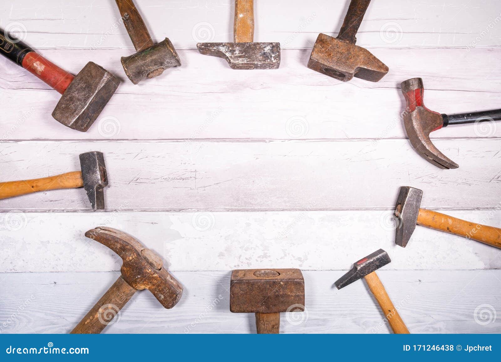 Set of Different Types of Old Hammers Put in Circles on a Wooden ...