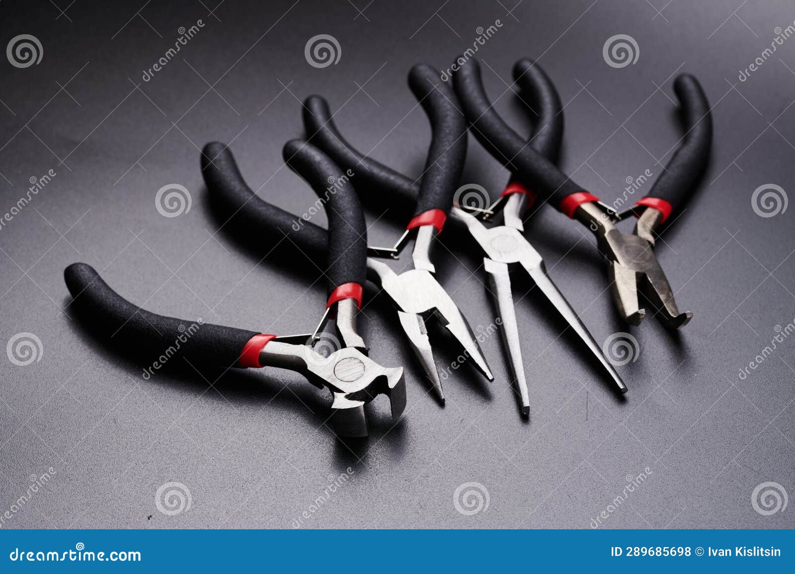 Set of Different Types of Pliers and Side Cutters Isolated on Black ...
