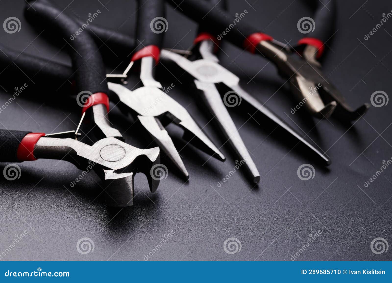 Set of Different Types of Pliers and Side Cutters Isolated on Black ...