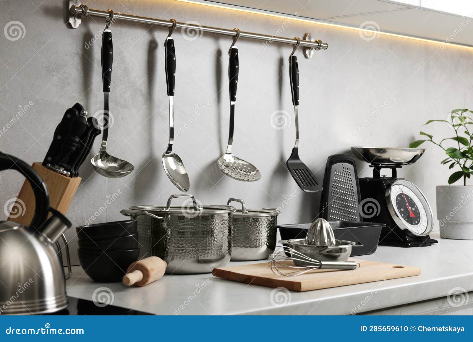 Set of Different Utensils on Countertop in Kitchen Stock Photo - Image ...