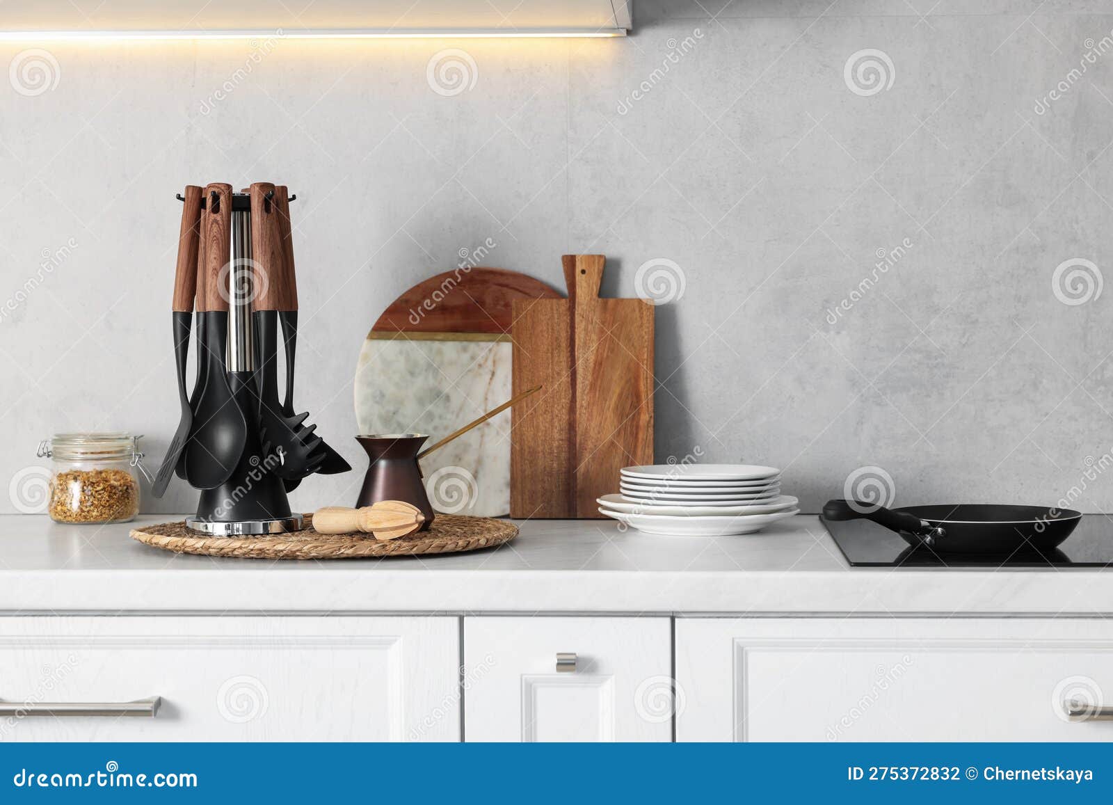 Set of Different Utensils and Dishes on Countertop in Kitchen Stock ...
