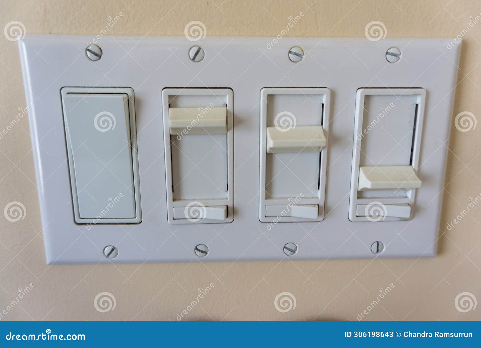 Set of Dimmer Light Switches Fixed on a Plate on a Wall Stock Image ...