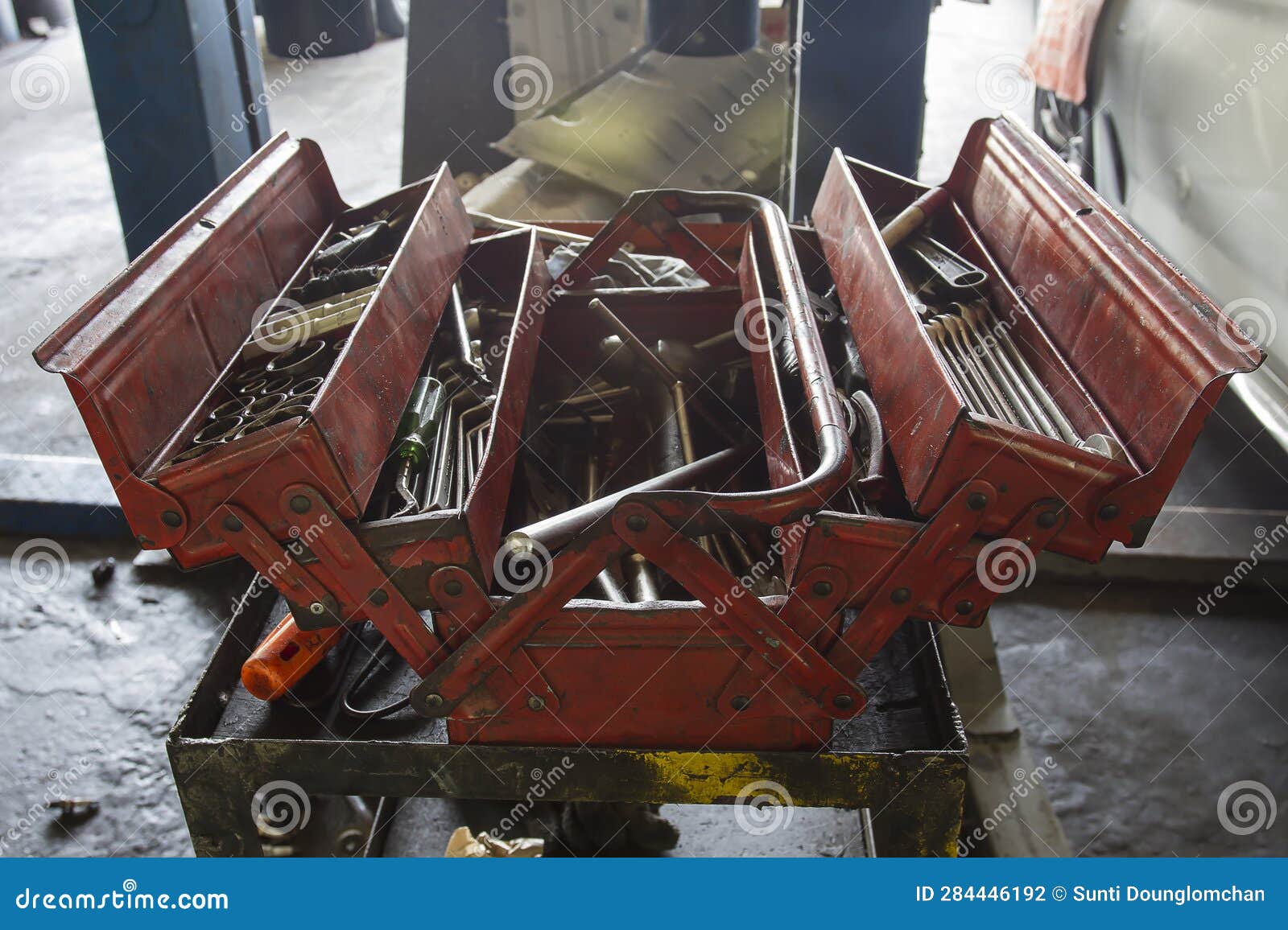 A Dirty Tool For Laying Ceramic Tiles Is On The Floor. Toothed Spatula ...