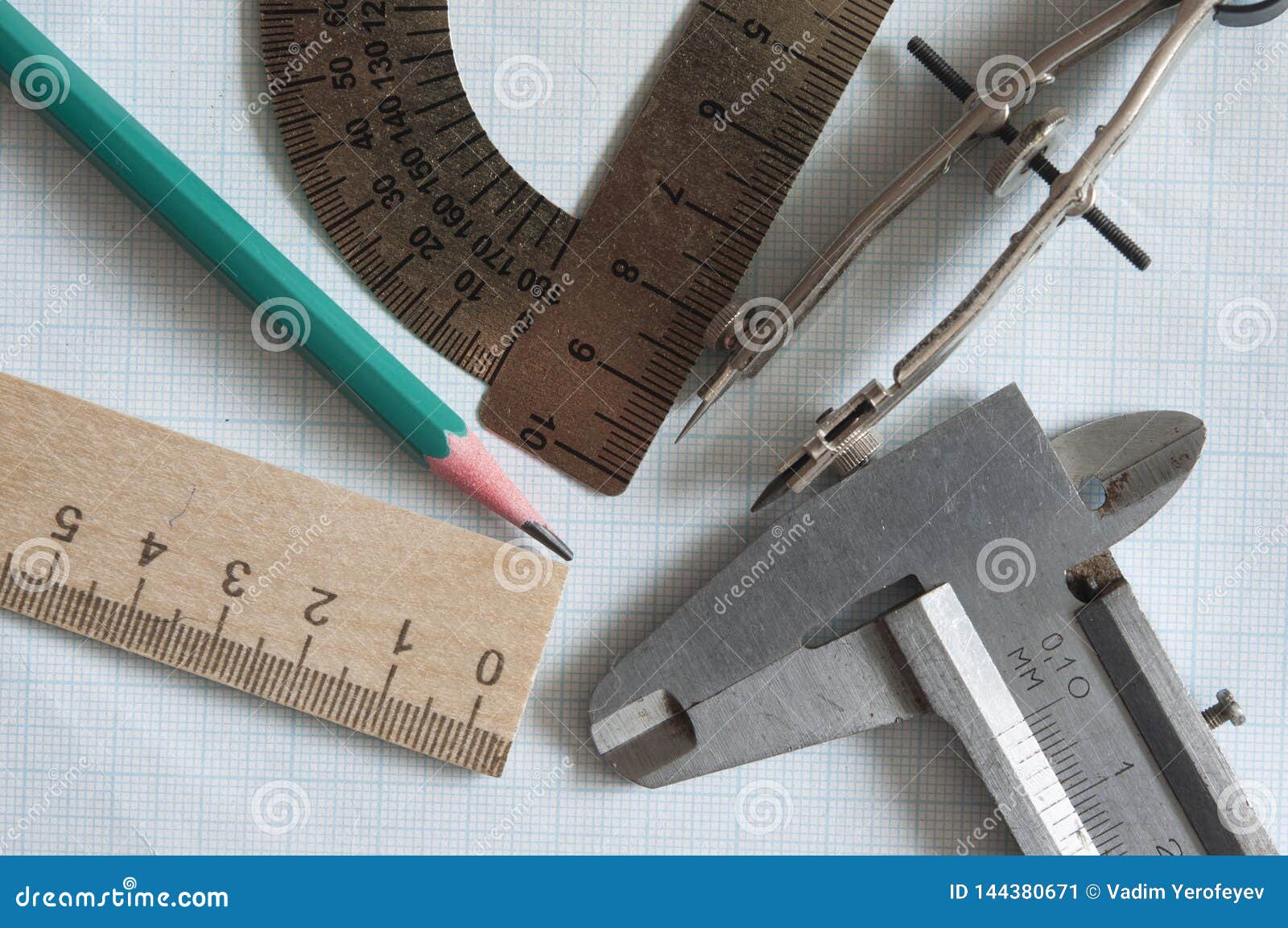 Set of Drawing Instrument and Rulers on Graph Paper Stock Image - Image ...