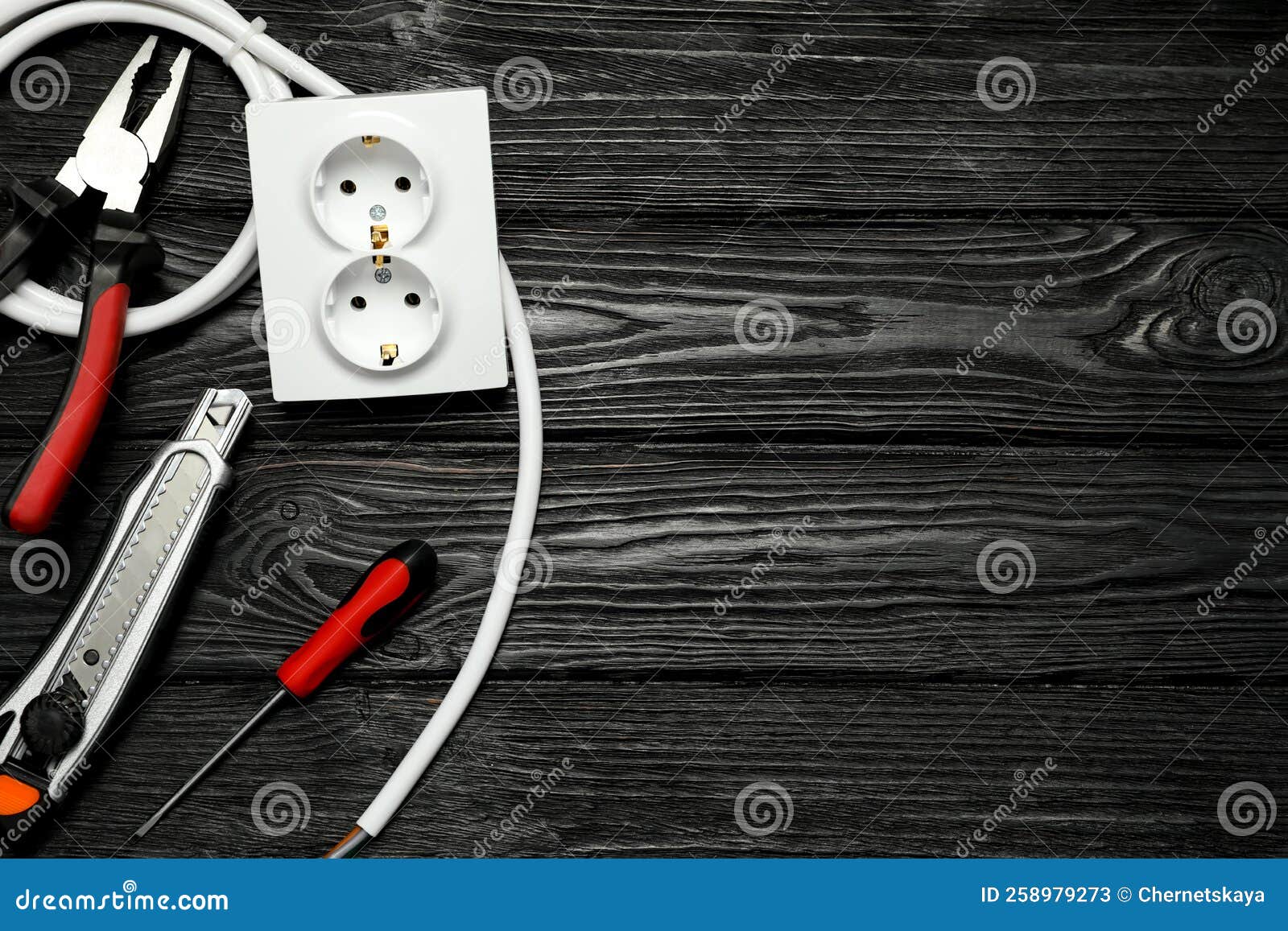 Set of Electrician`s Tools and Power Socket on Black Wooden Table, Flat ...