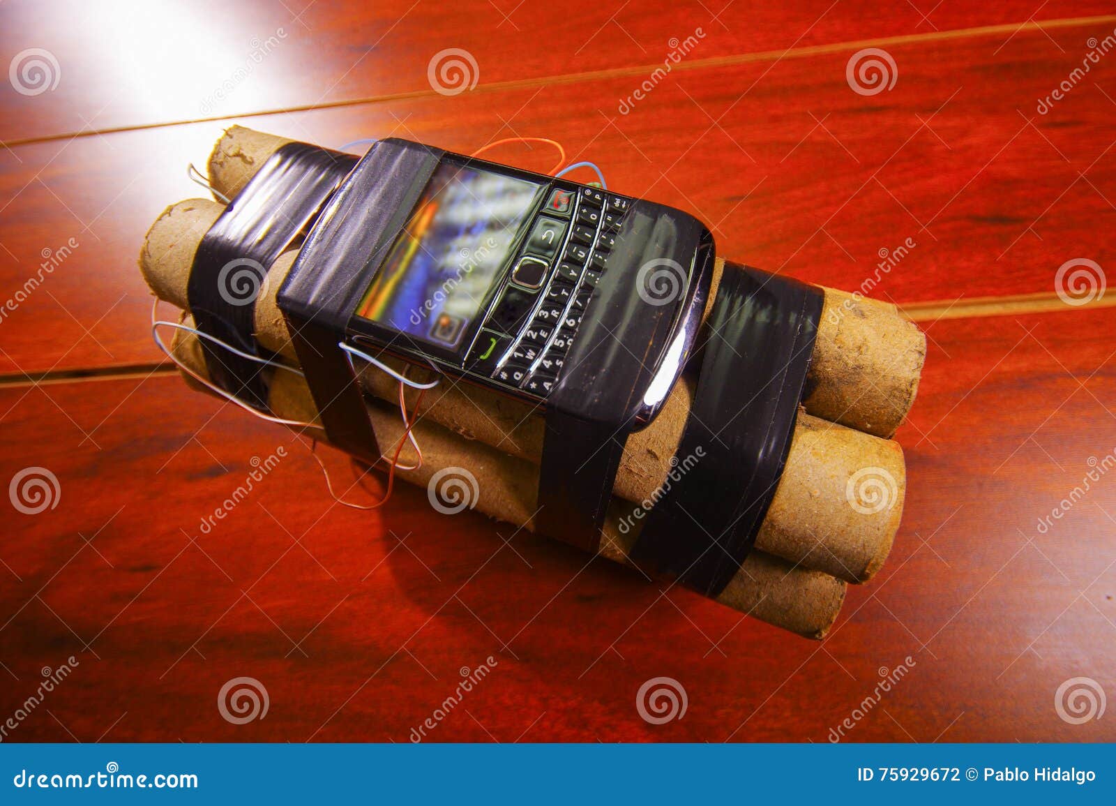 Set of Explosives Conected To a Cellphone Laying on the Ground Stock ...