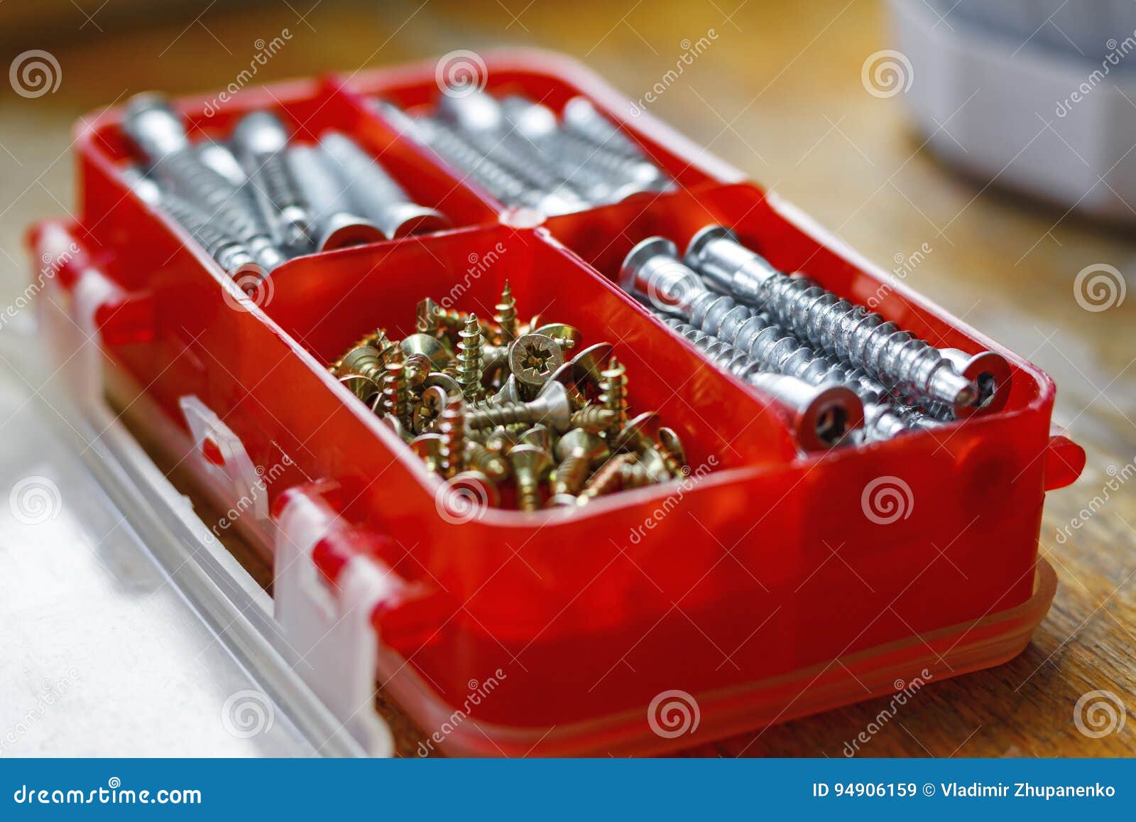 Set of Fasteners for Assembling Furniture in a Red Plastic Storage Box ...