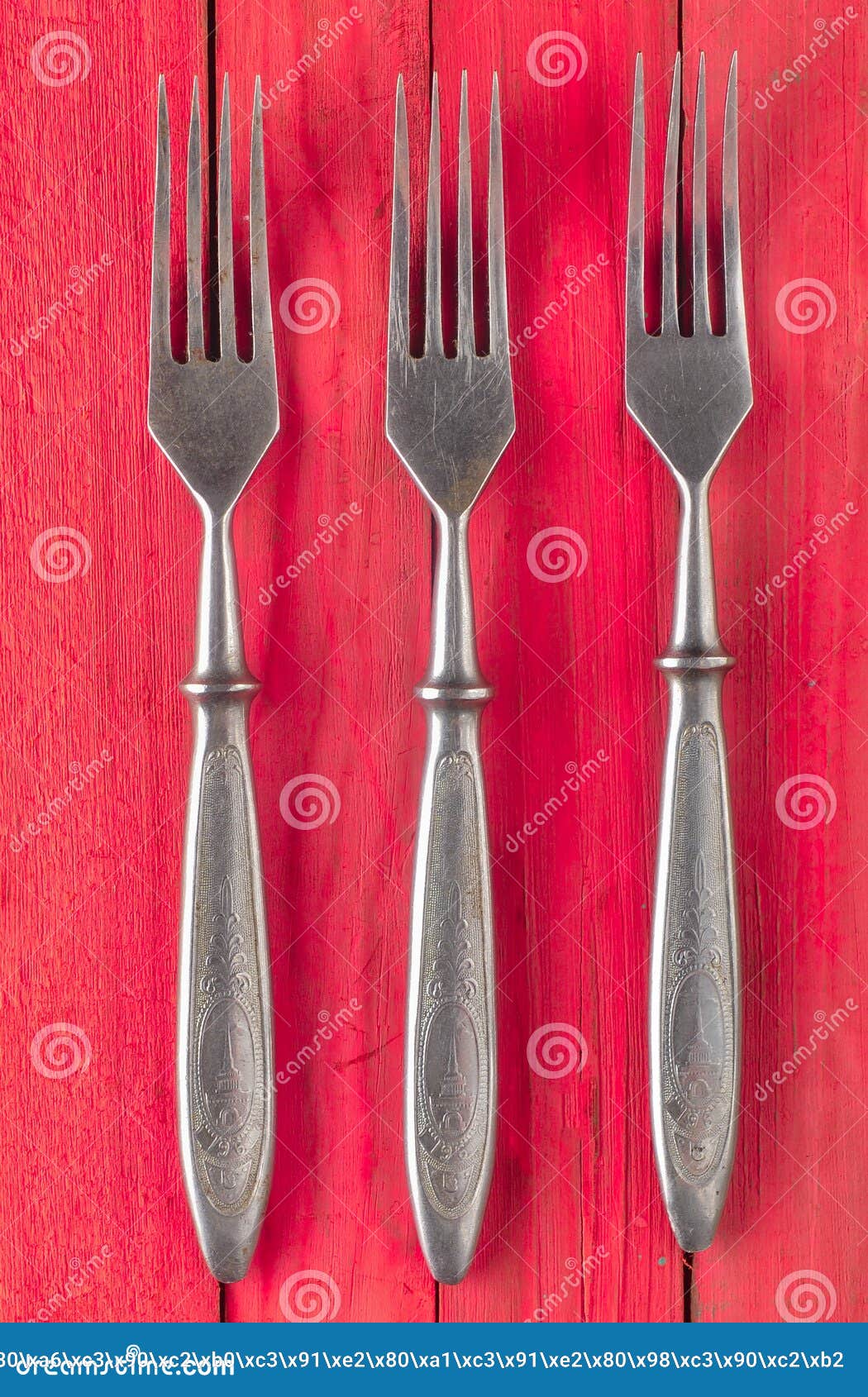 A Set of Forks on a Red Wooden Surface. Top View Stock Photo - Image of ...