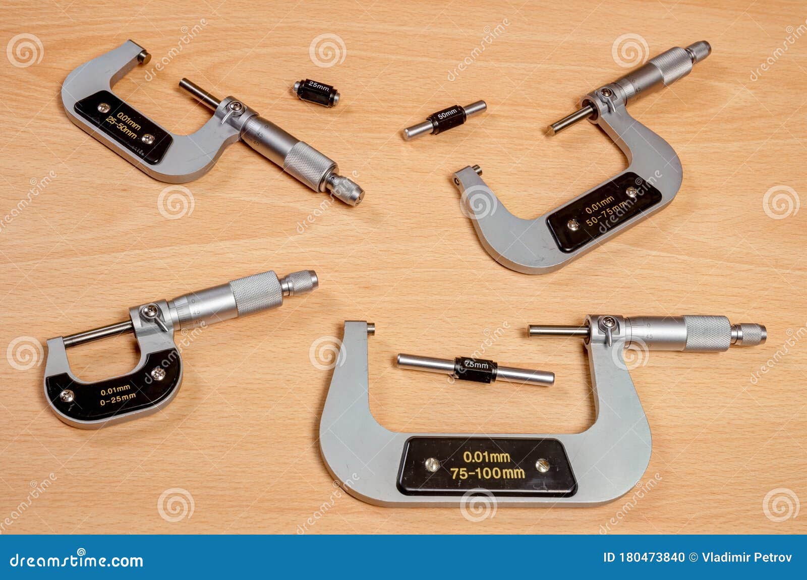 Set of Four Micrometers on Brown Table Stock Photo - Image of ...