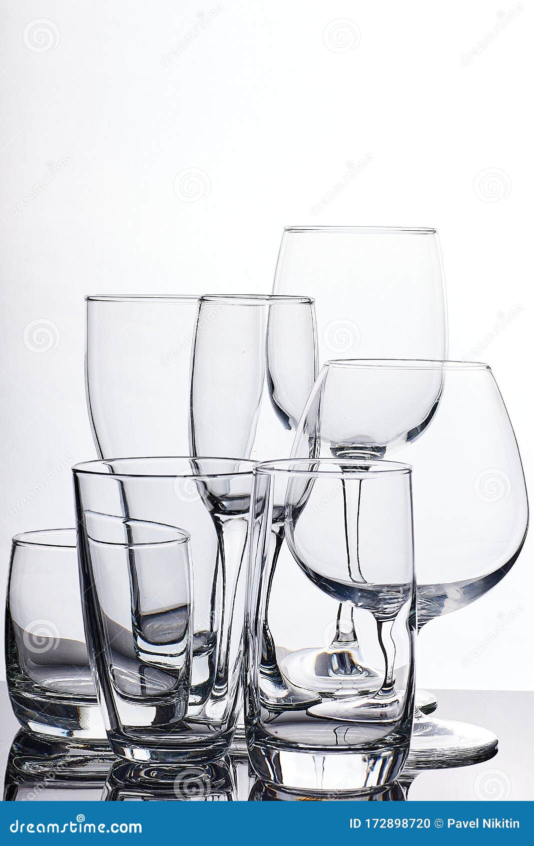 Set of Glass Empty Glasses and Goblets on a Gray-white Background Stock ...