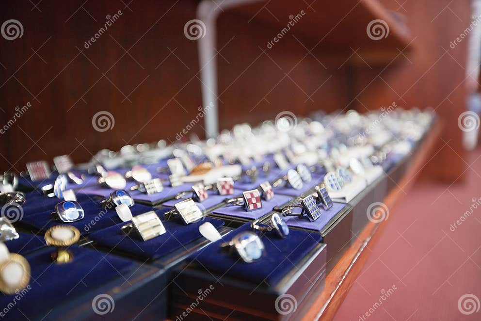 Set of Hand Cufflinks on Display Stock Image - Image of jewelry ...