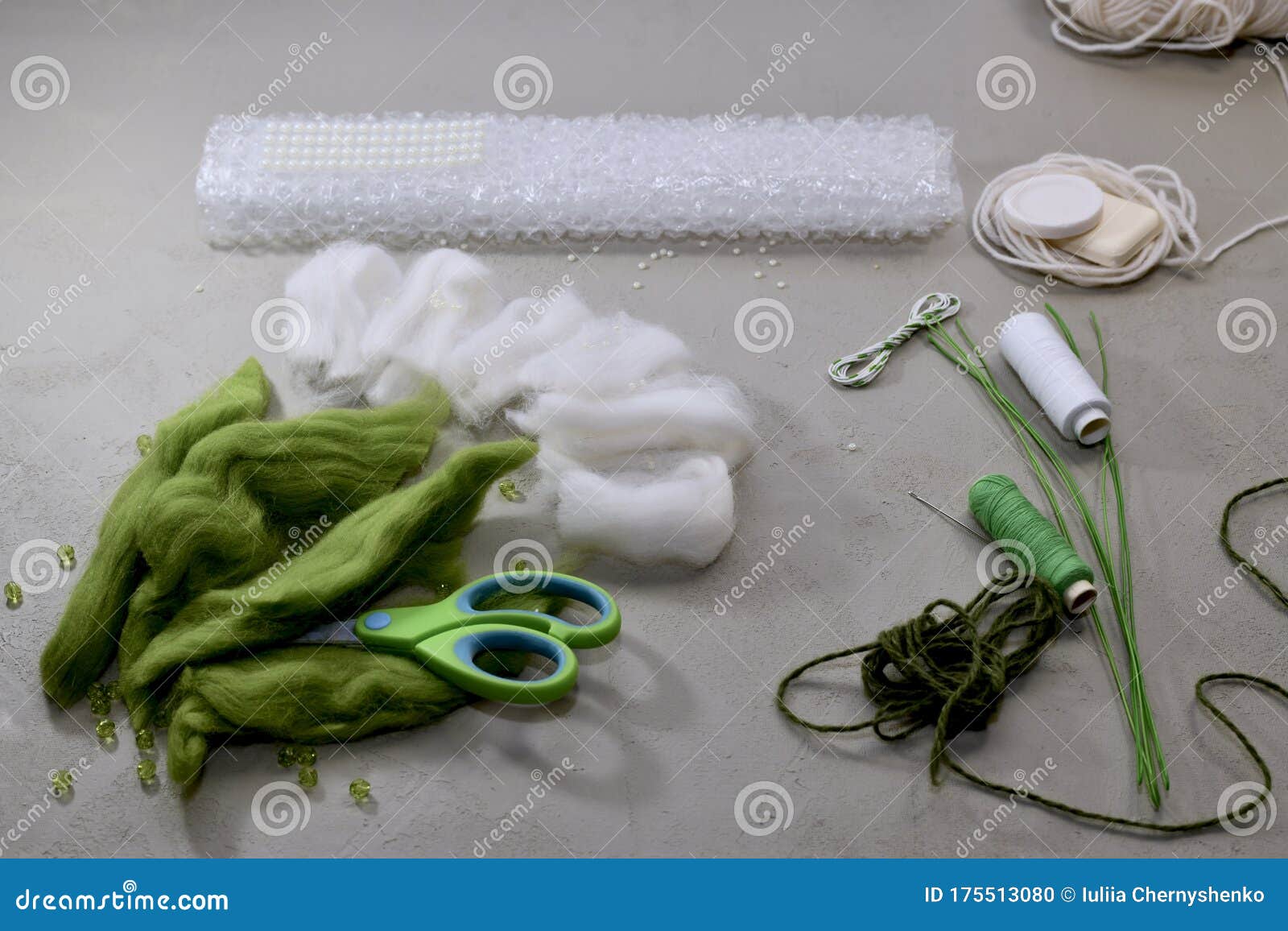 A Set of Items for Needlework Making Snowdrops Made of Wool on a Gray ...