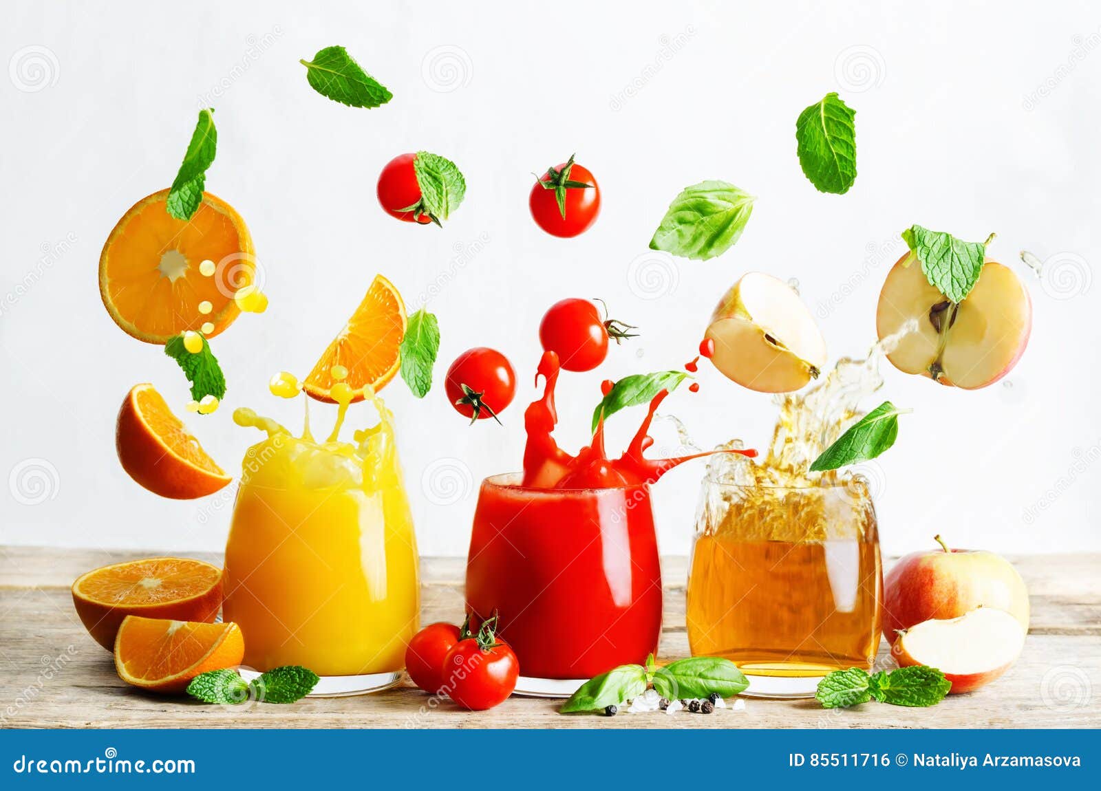 Set of Juices: Orange, Tomato and Apple with Flying Slices Stock Photo ...