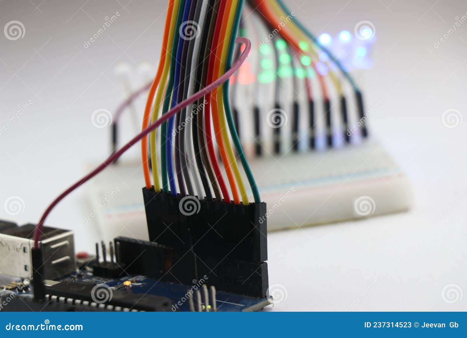Set of Jumper Wires Connected To a Microcontroller Board that Completes ...