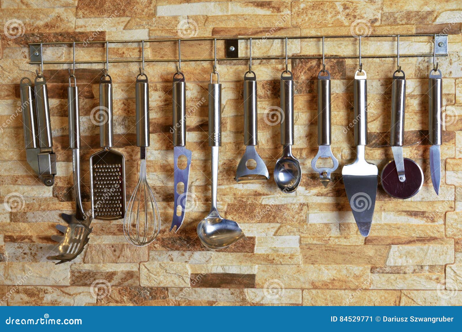 Set of Kitchen Utensils Hanging on the Wall Stock Image - Image of ...
