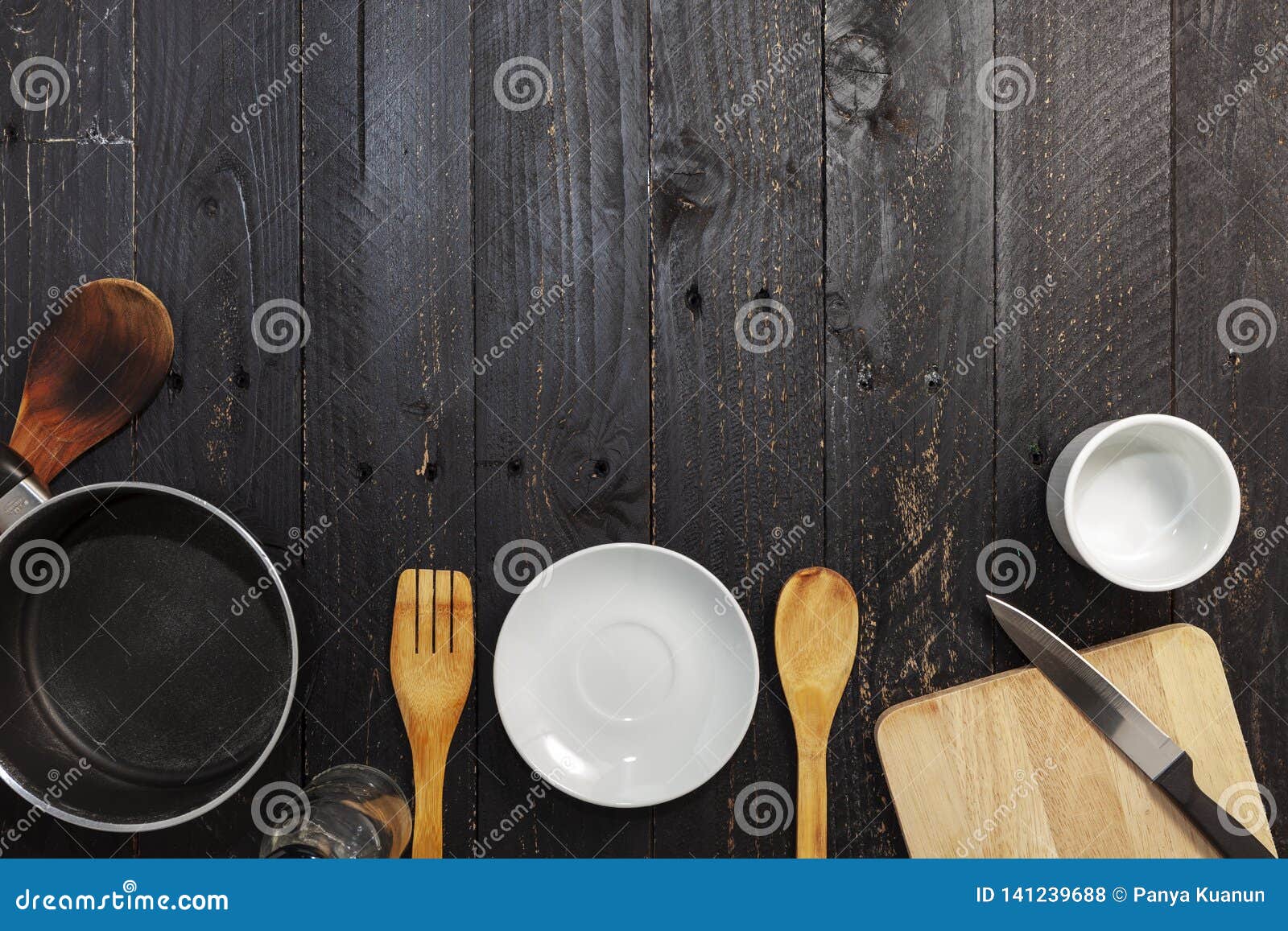 Set of Kitchenware on the Black Wooden Background Stock Photo - Image ...
