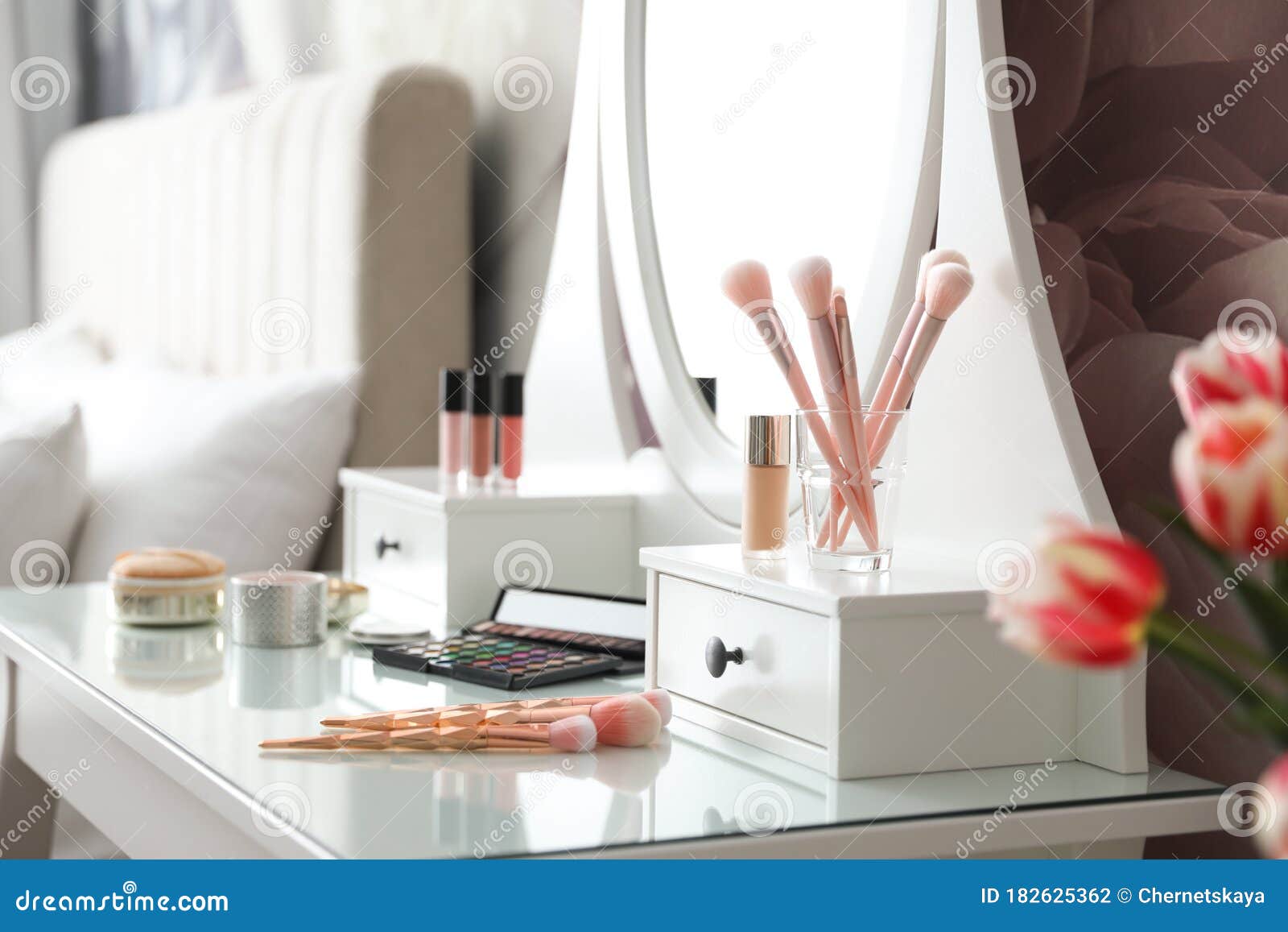 Set of Makeup Products and Cosmetic Brushes on Dressing Table. Interior ...