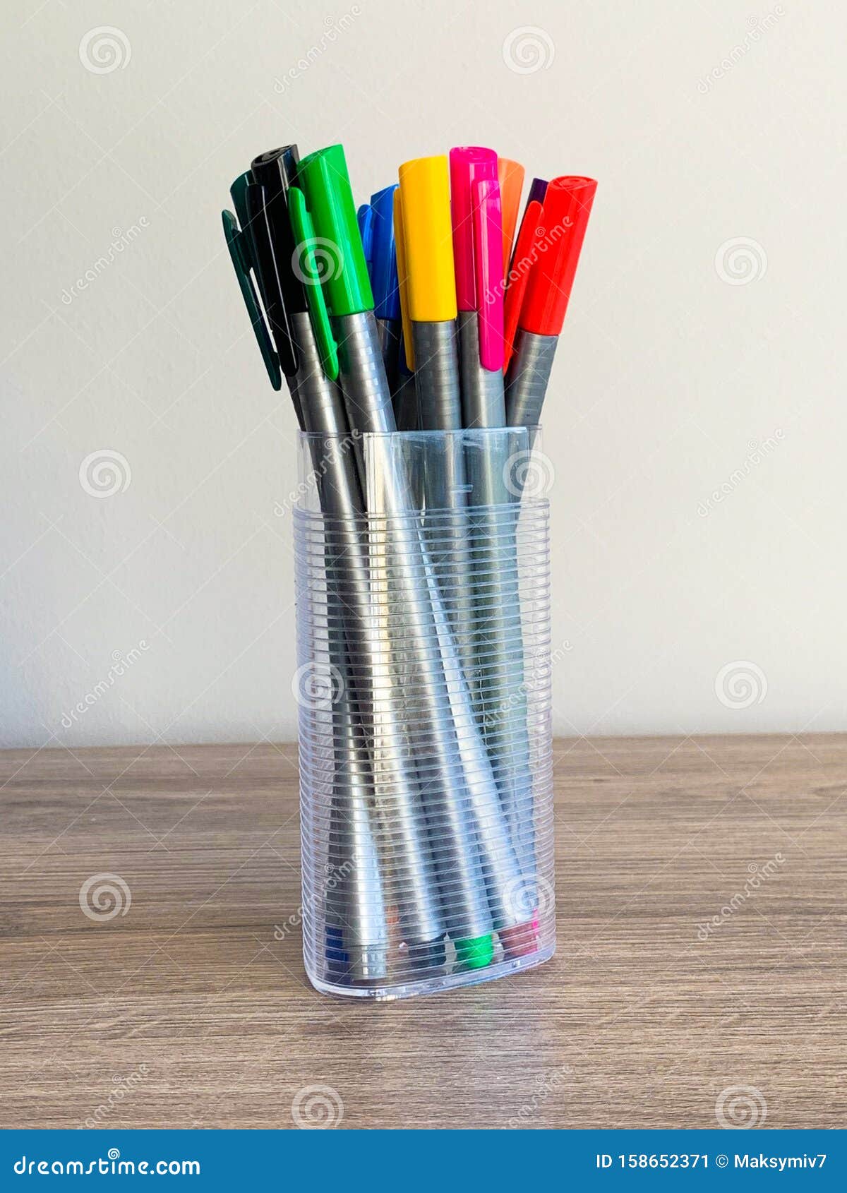 Set of Markers in a Plastic Cup on Wood Table. Stock Image - Image of ...