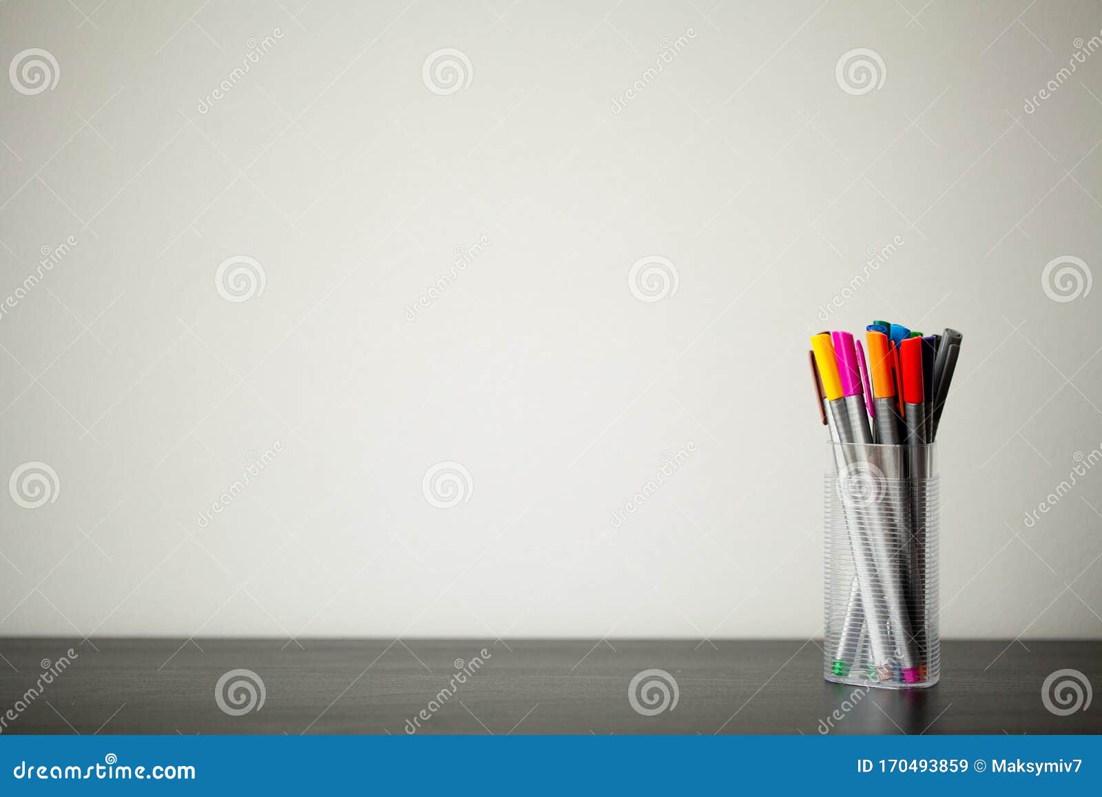 Set of Markers in a Plastic Cup on Wood Table. Stock Image - Image of ...