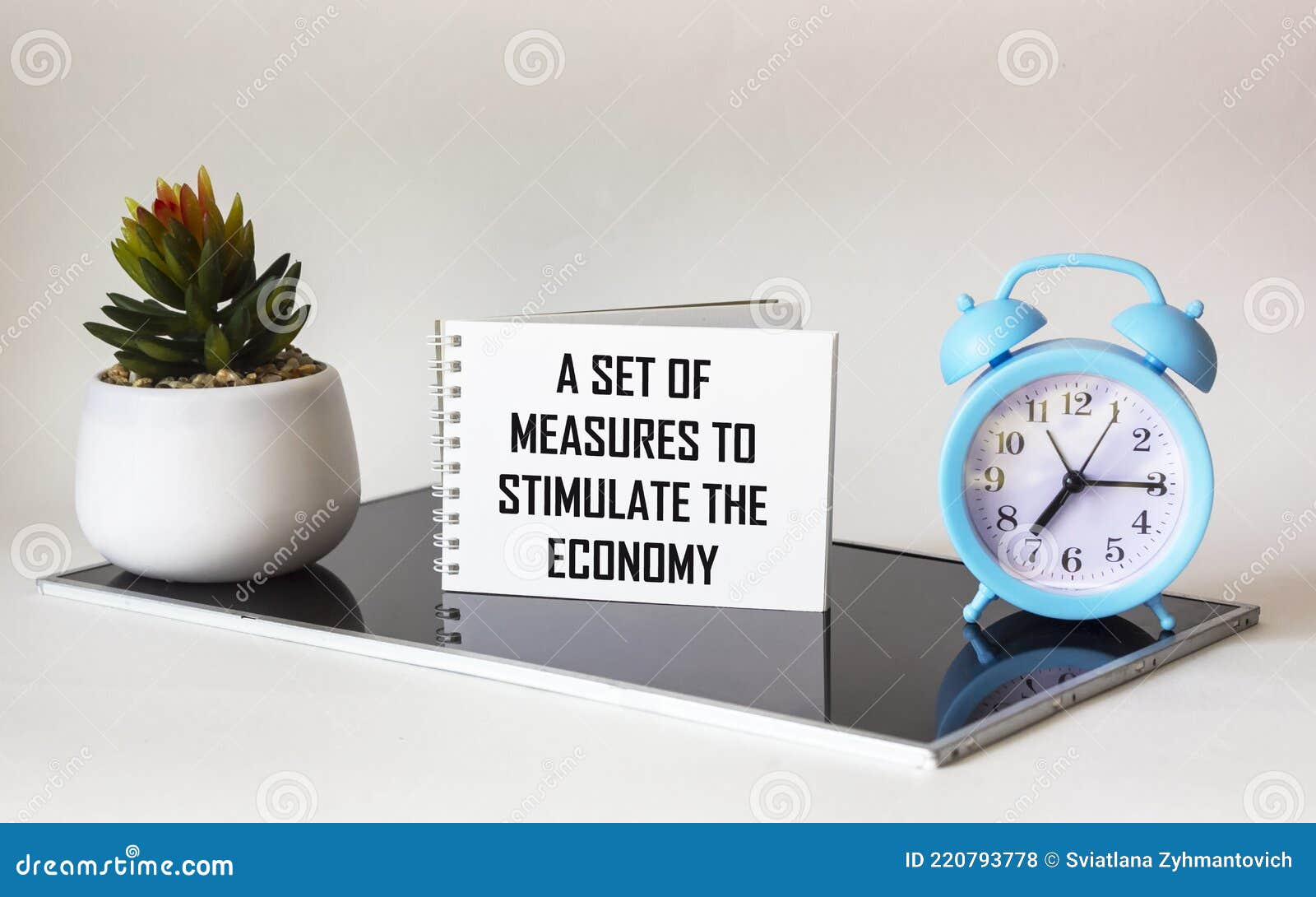 A Set of Measures To Stimulate the Economy, Text on a Notepad and on a ...