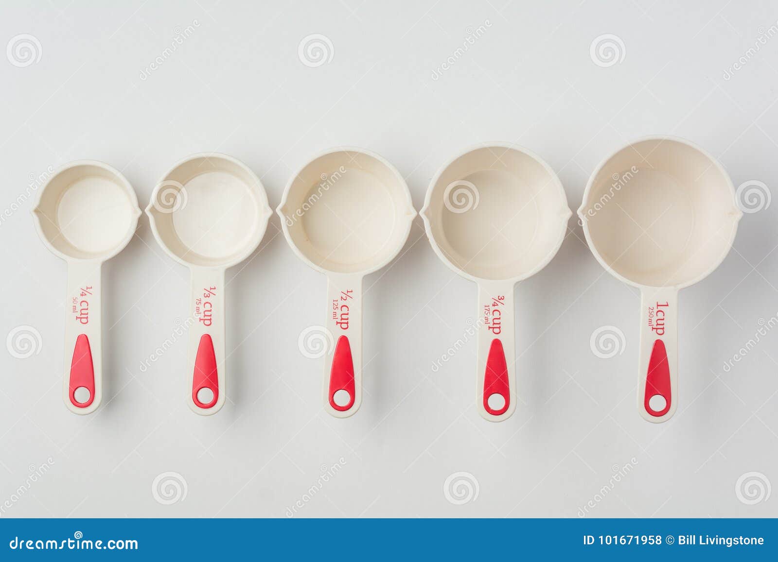 Set of Measuring Cups Lined on White Background Top View Stock Photo ...