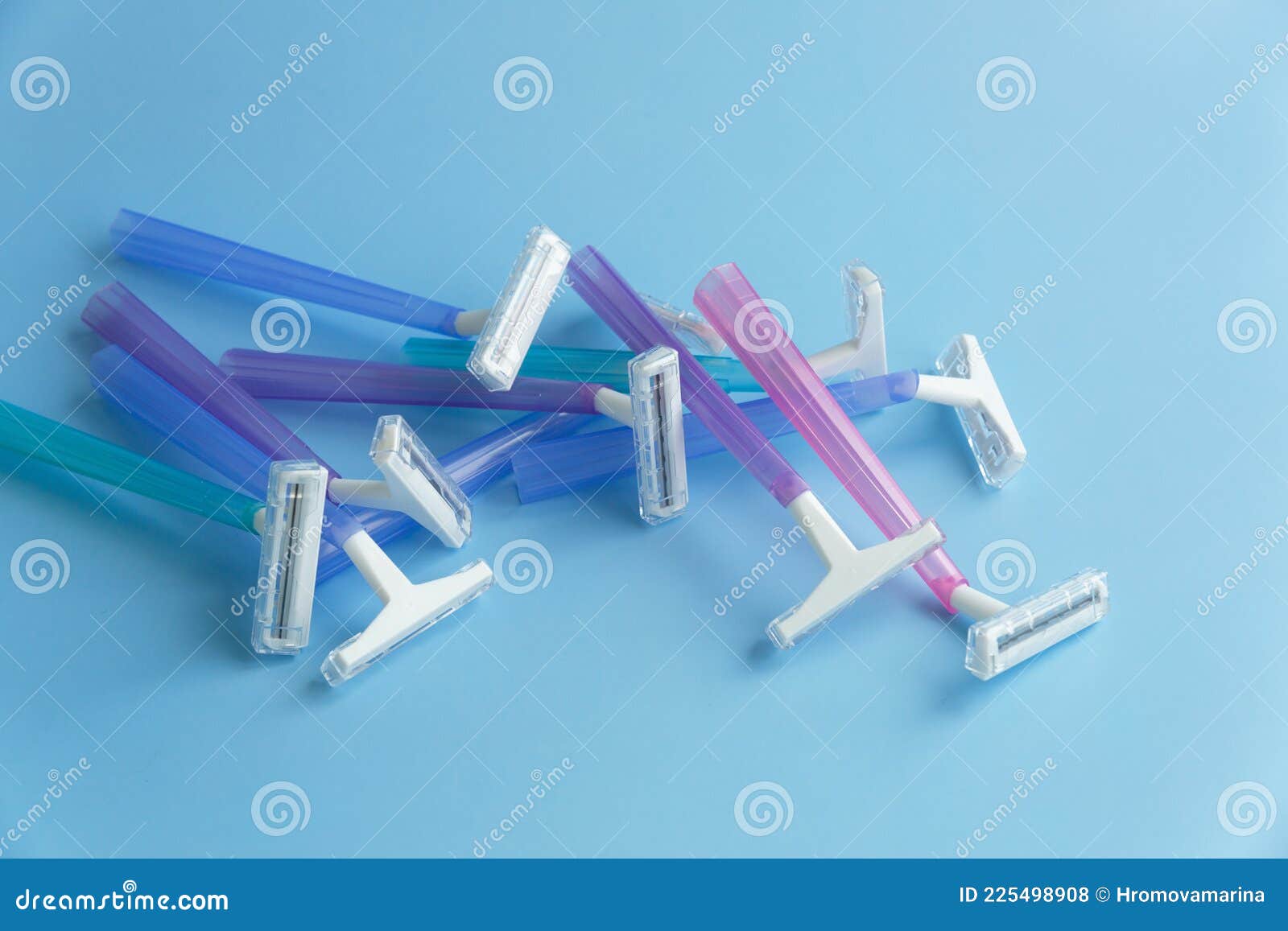 Set of Multi-colored Disposable Razors on a Blue Background Stock Photo ...