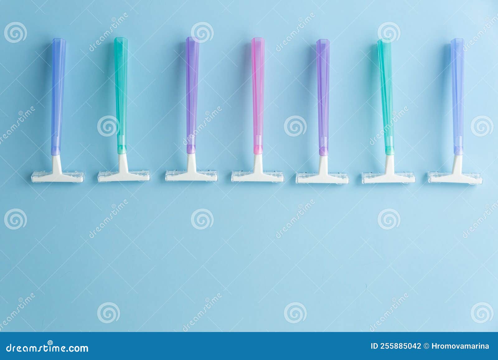 Set of Multi-colored Disposable Razors on a Blue Background Stock Photo ...