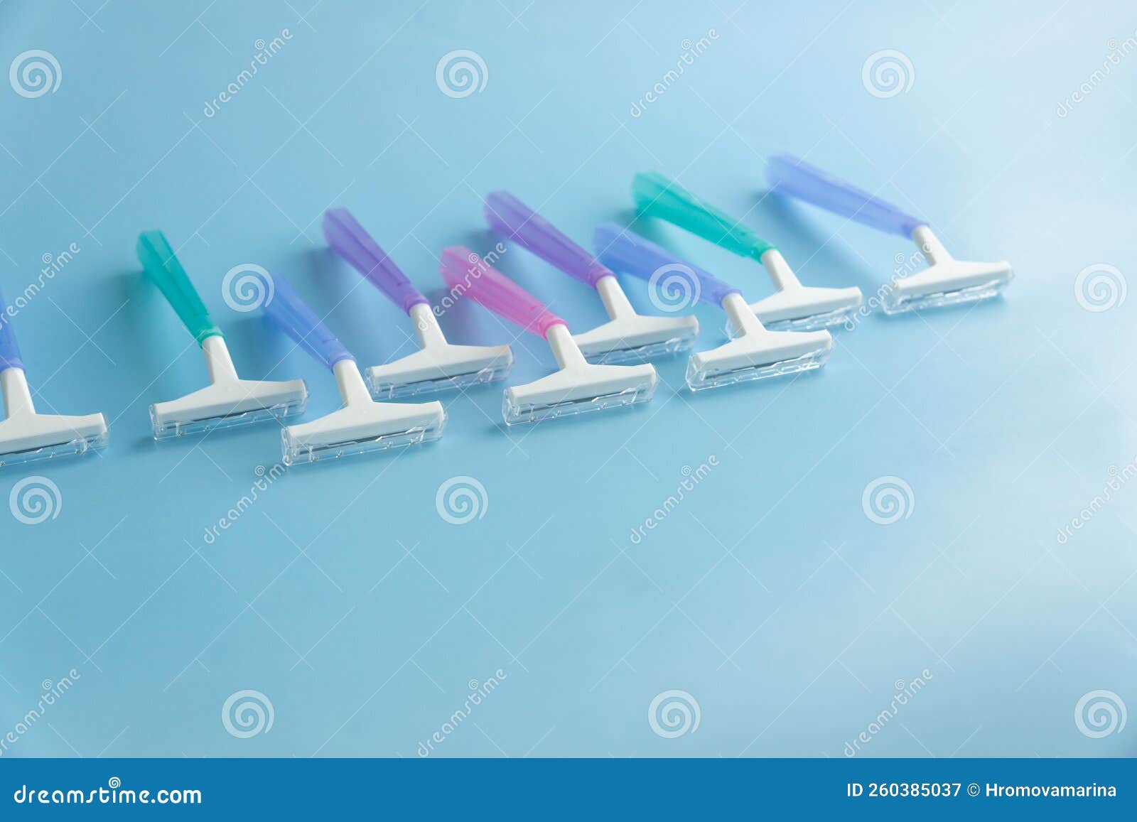 Set of Multi-colored Disposable Razors on a Blue Background Stock Image ...