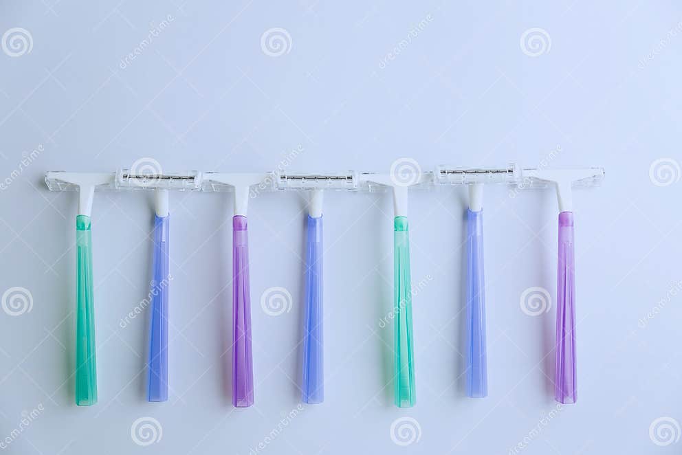 Set of Multi-colored Disposable Razors on a White Background View from ...