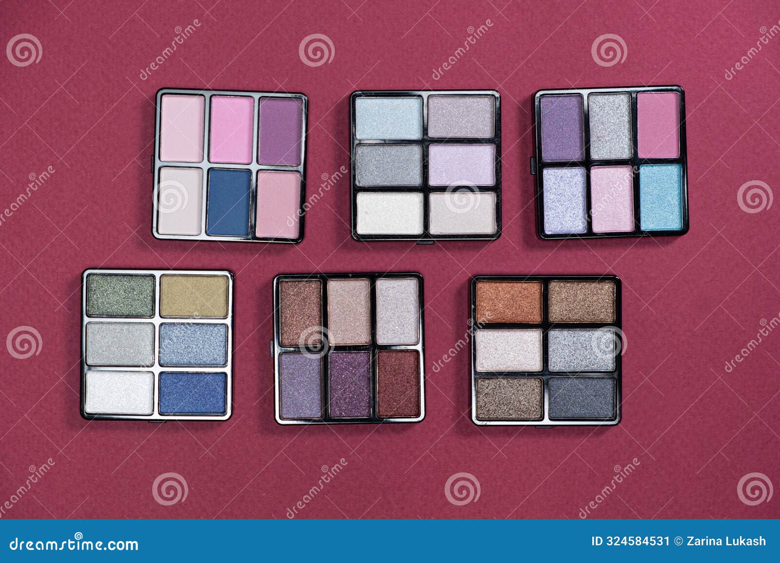 A Set of Multi-colored Eyeshadow on a Pink Background. Eye Makeup Stock ...