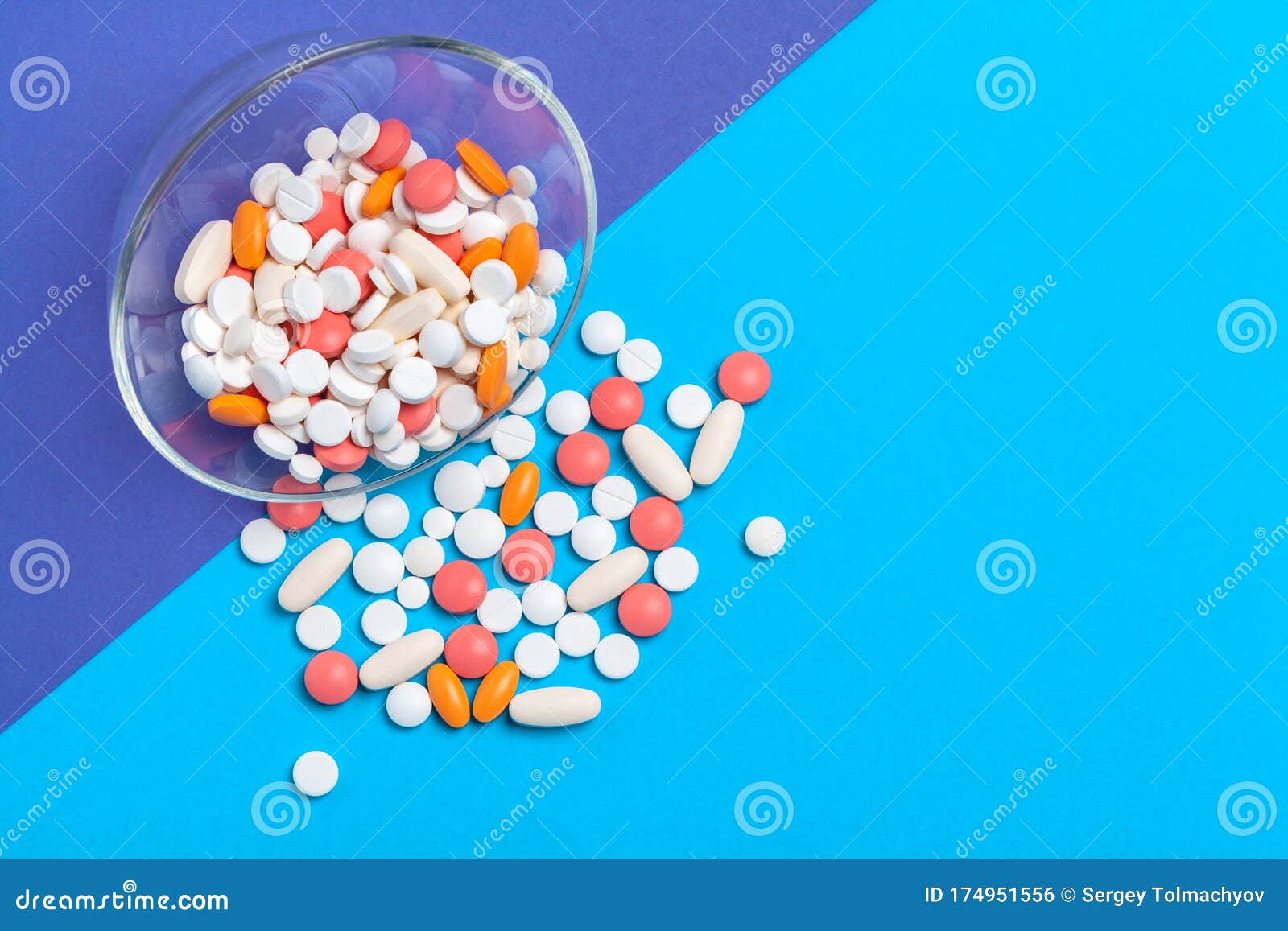 Set of Multi-colored Tablets and Capsules on a Blue Background Stock ...