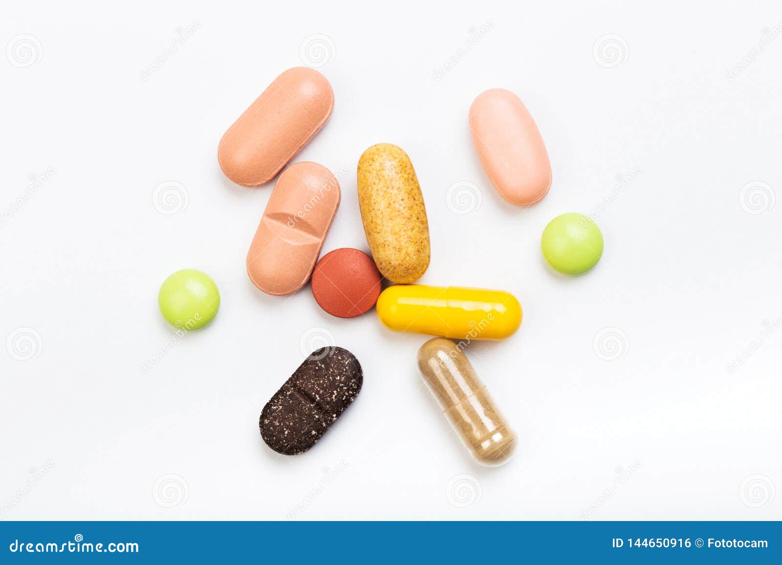 Set of Multi-colored Tablets and Capsules on a White Background Stock ...