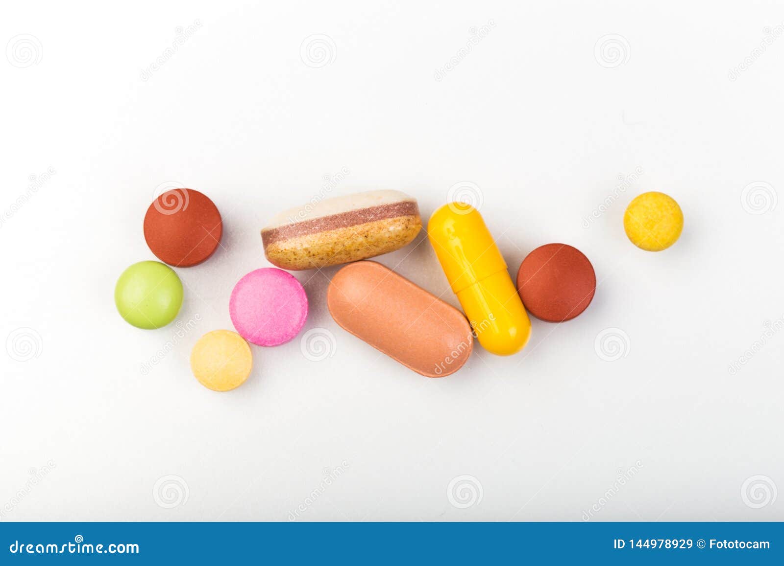 Set of Multi-colored Tablets and Capsules on a White Background Stock ...