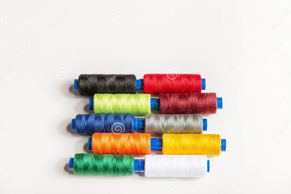 Set of Multi-colored Threads for Sewing on a White Background Stock ...
