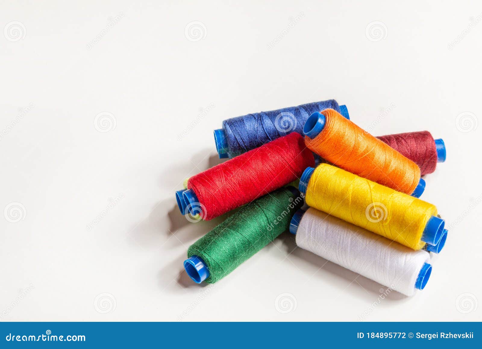Set of Multi-colored Threads for Sewing on a White Background Stock ...