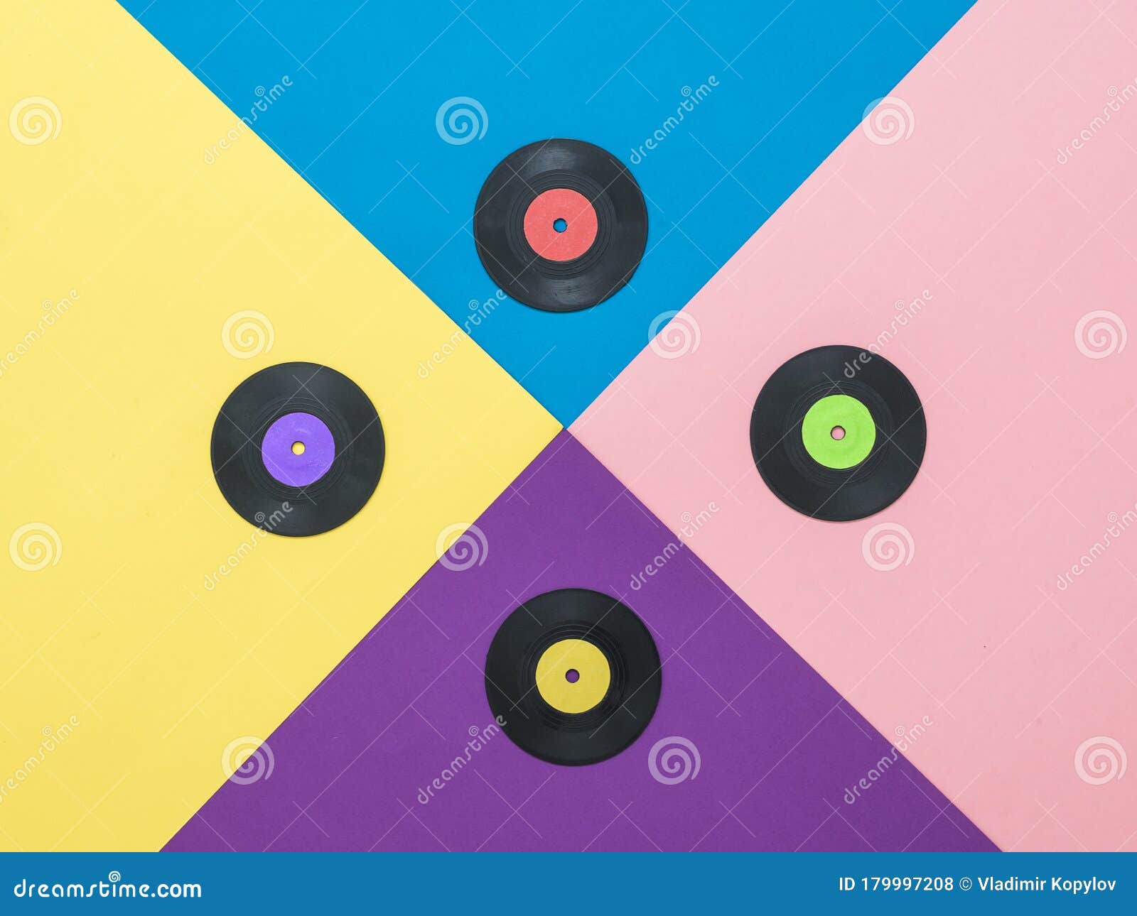 A Set of Multi-colored Vinyl Discs on a Multi-colored Background ...