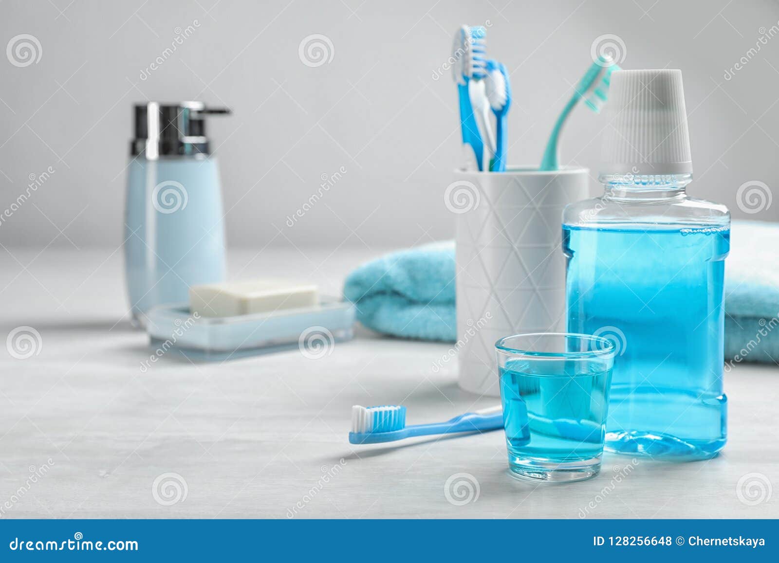Set of Oral Care Products on Light Table Stock Photo - Image of glass ...