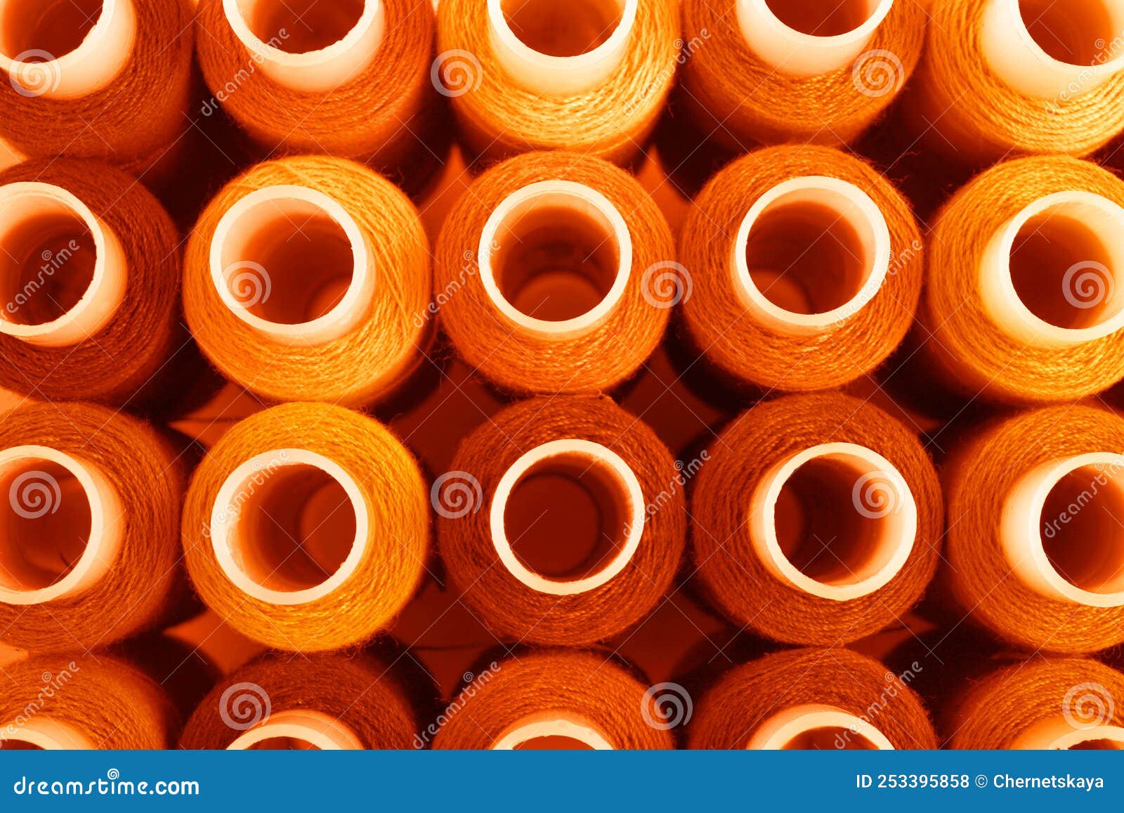 Set of Orange Sewing Threads As Background, Top View Stock Photo ...