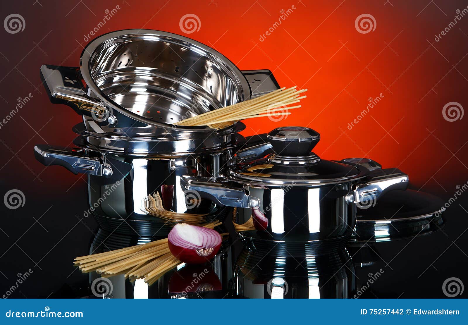 A Set of Pots and Pans on a Dark Background Stock Photo - Image of ...