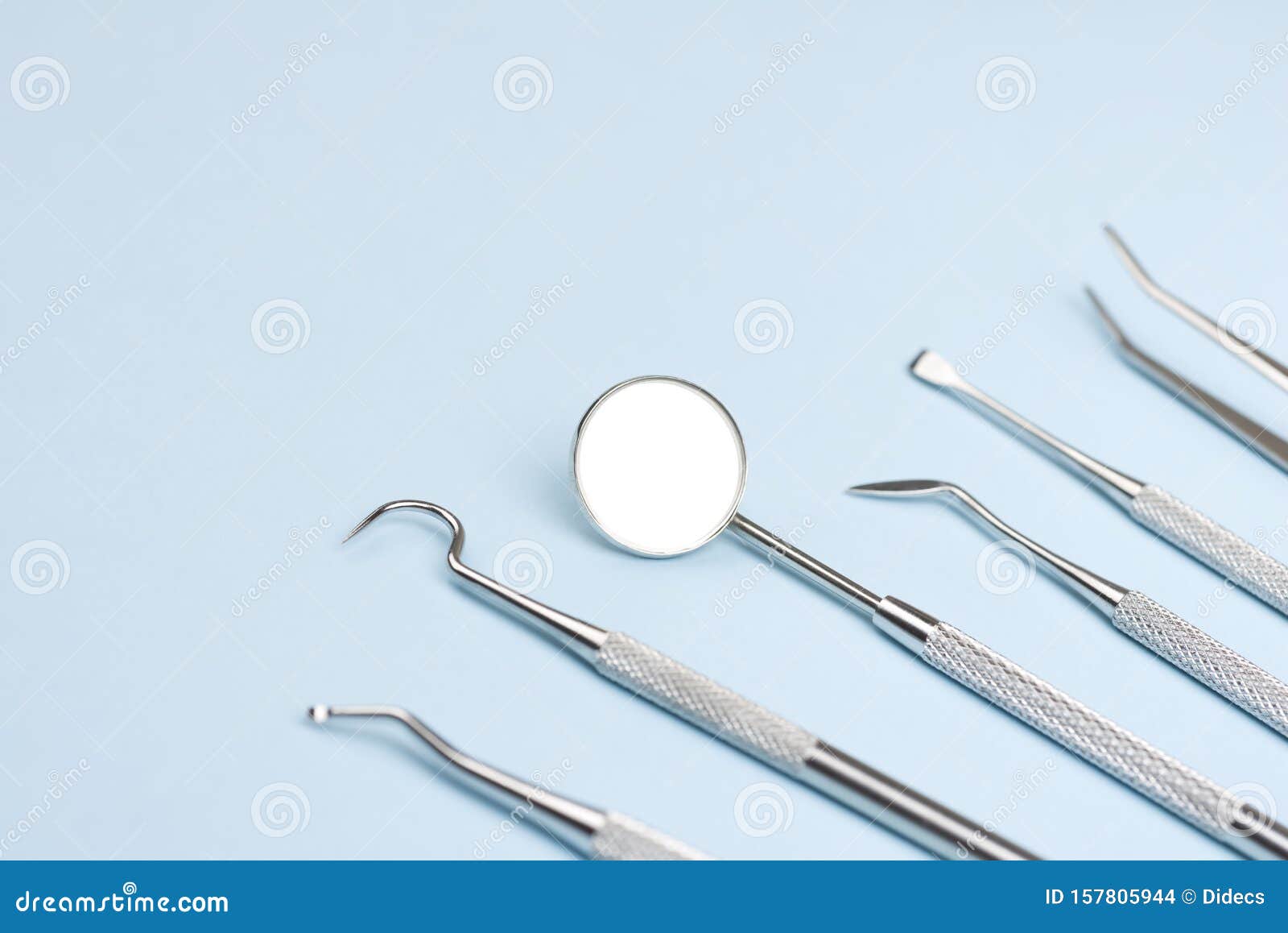 Set of Professional Dentist Instruments on Light Blue Background Stock ...